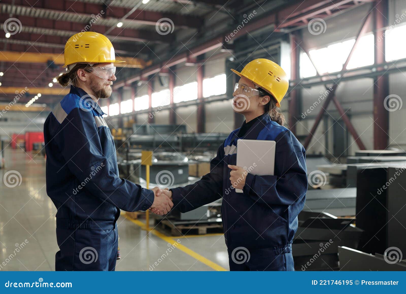 Industrial Colleagues Making Handshake in Workshop Stock Image - Image ...