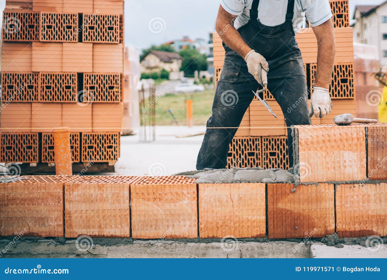 Construction Site Details with Worker Laying Bricks Stock Image - Image ...
