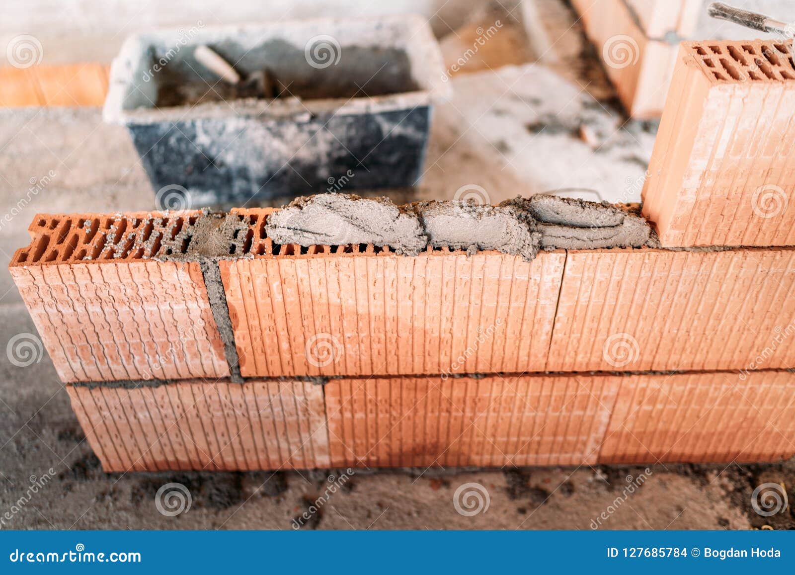 Construction Site Details with Worker Laying Bricks on Interior Walls ...