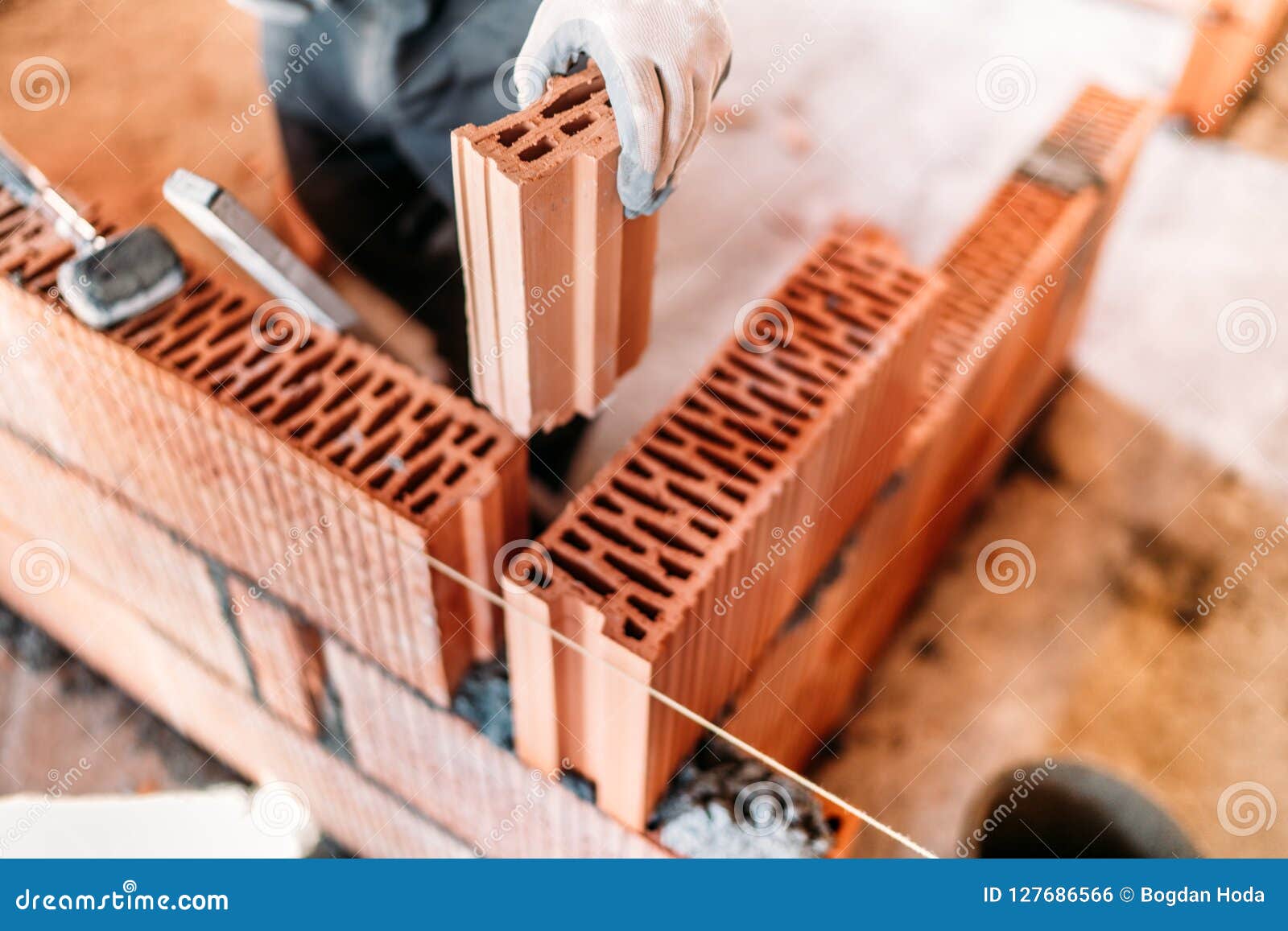Construction Worker Using Spatula and Trowel for Building Walls with ...
