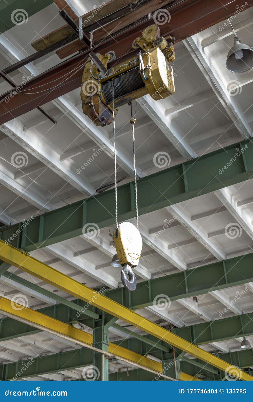 Industrial Crane Winch Under the Ceiling of the Hangar with Yellow and ...