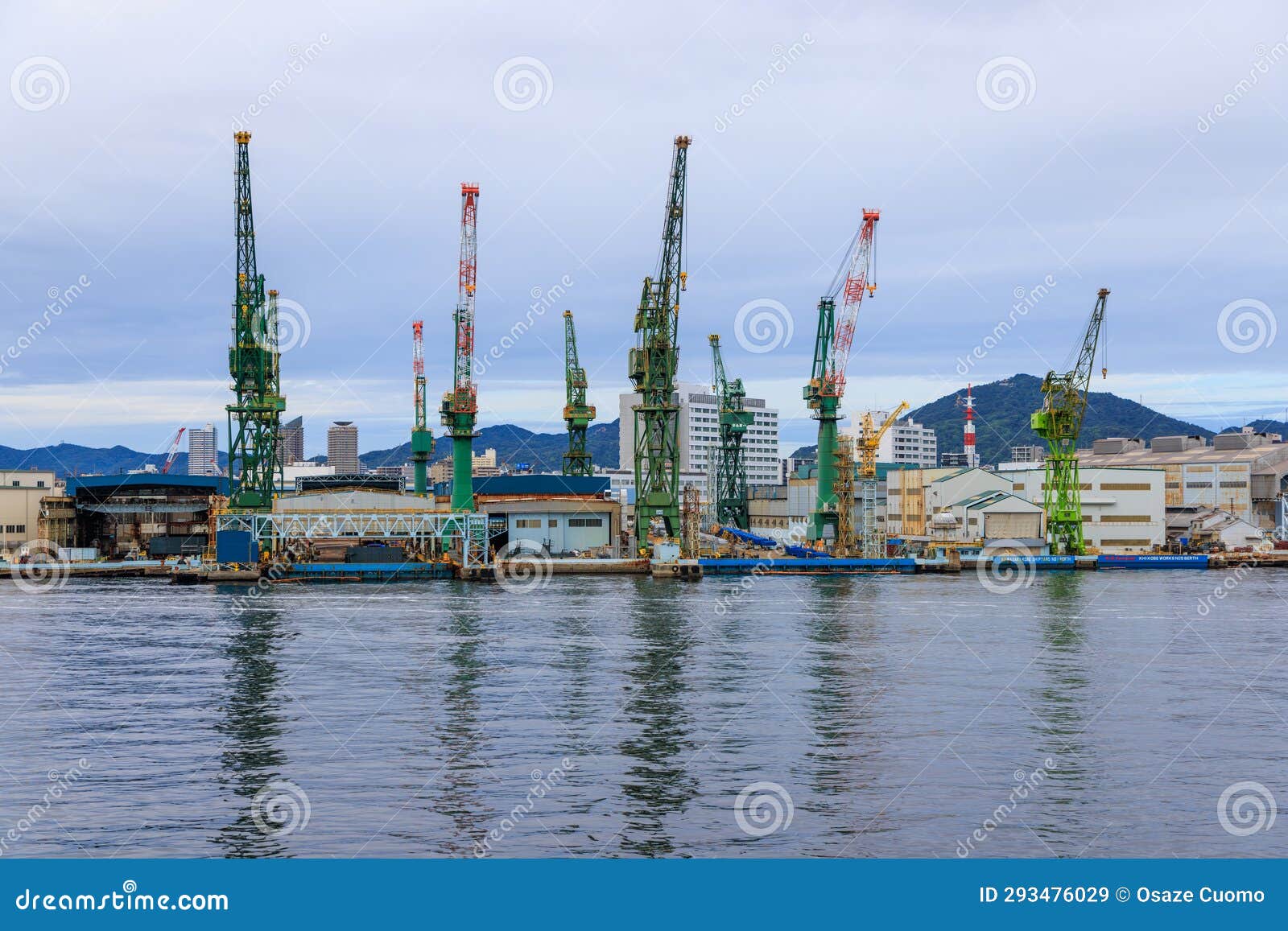 Industrial Cranes at Cargo Loading Dock at Quiet Harbor on Cloudy Day ...