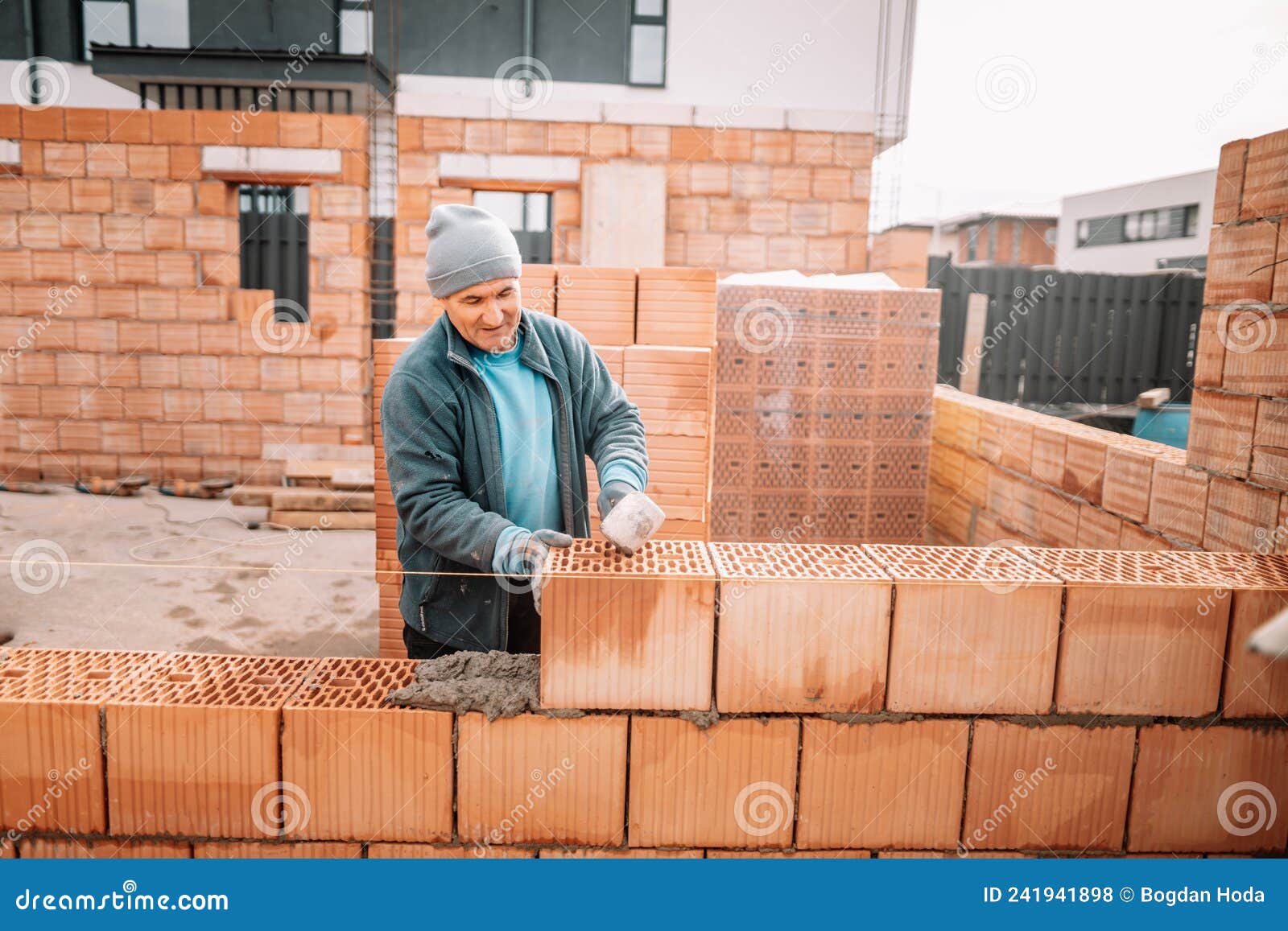 Construction Bricklayer Worker Building Walls with Bricks, Mortar and ...