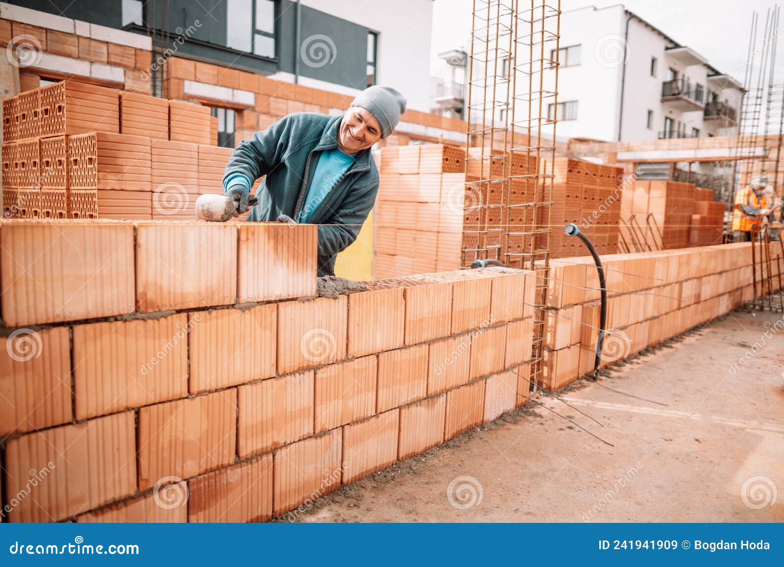 Construction Bricklayer Worker Smiling and Building Walls with Bricks ...