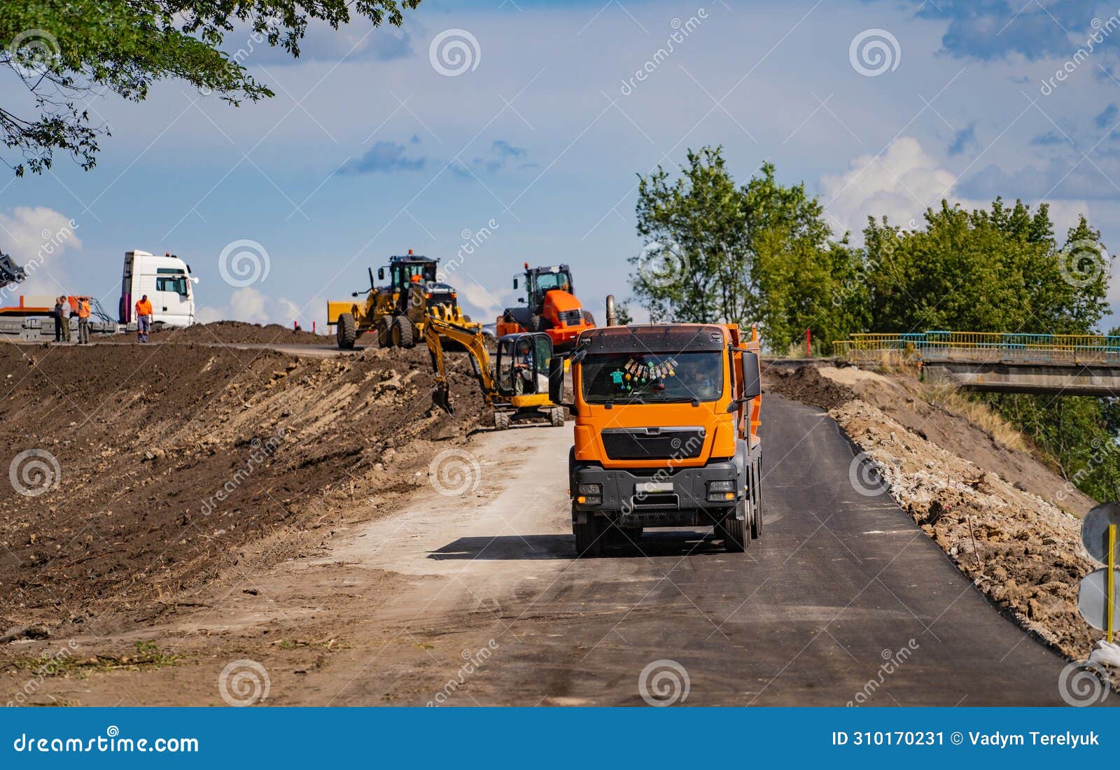 Industrial Dumper Trucks Working on Highway Construction Site, Loading ...