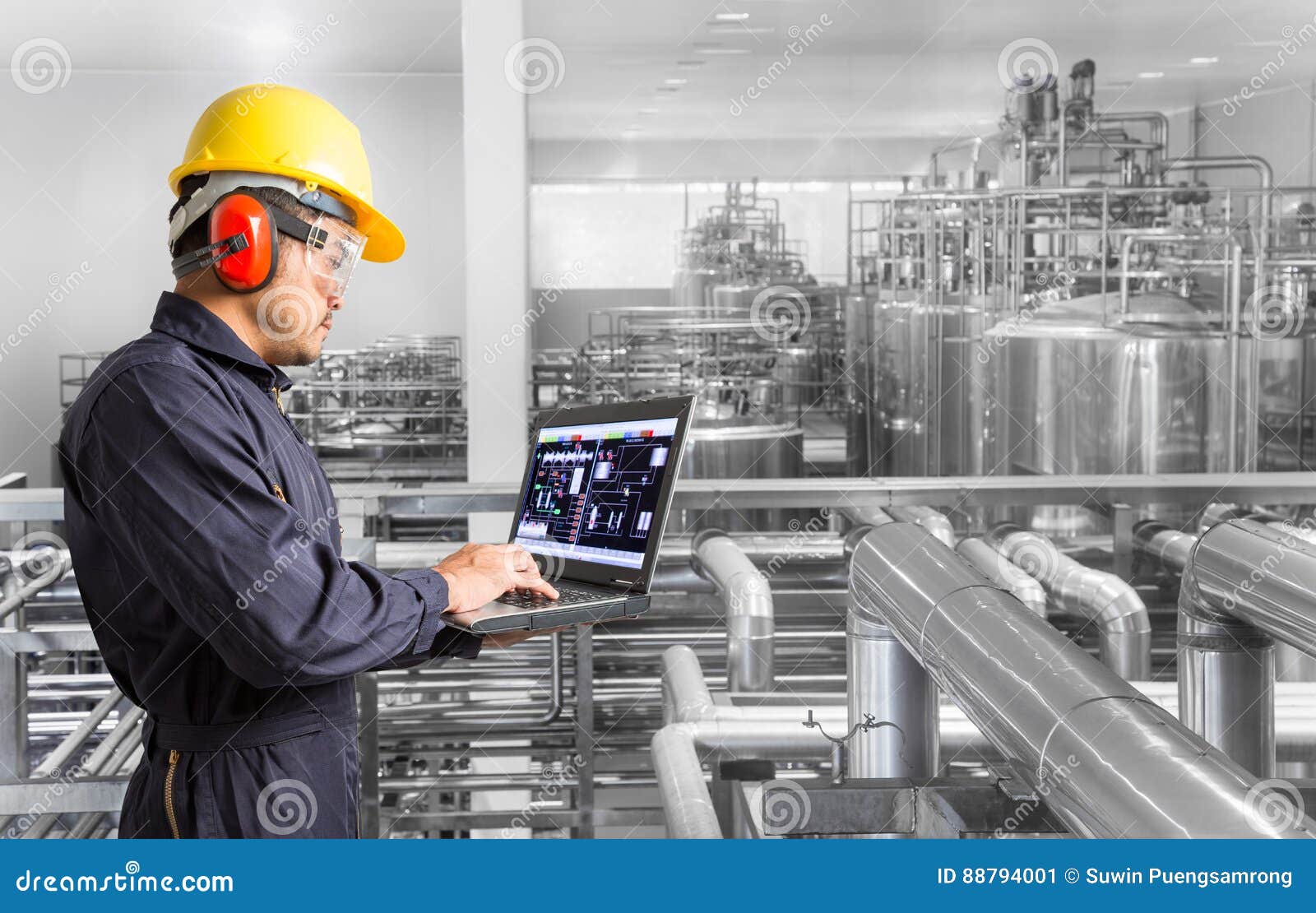 Industrial Engineer Checking Machine Status with Laptop Computer Stock ...