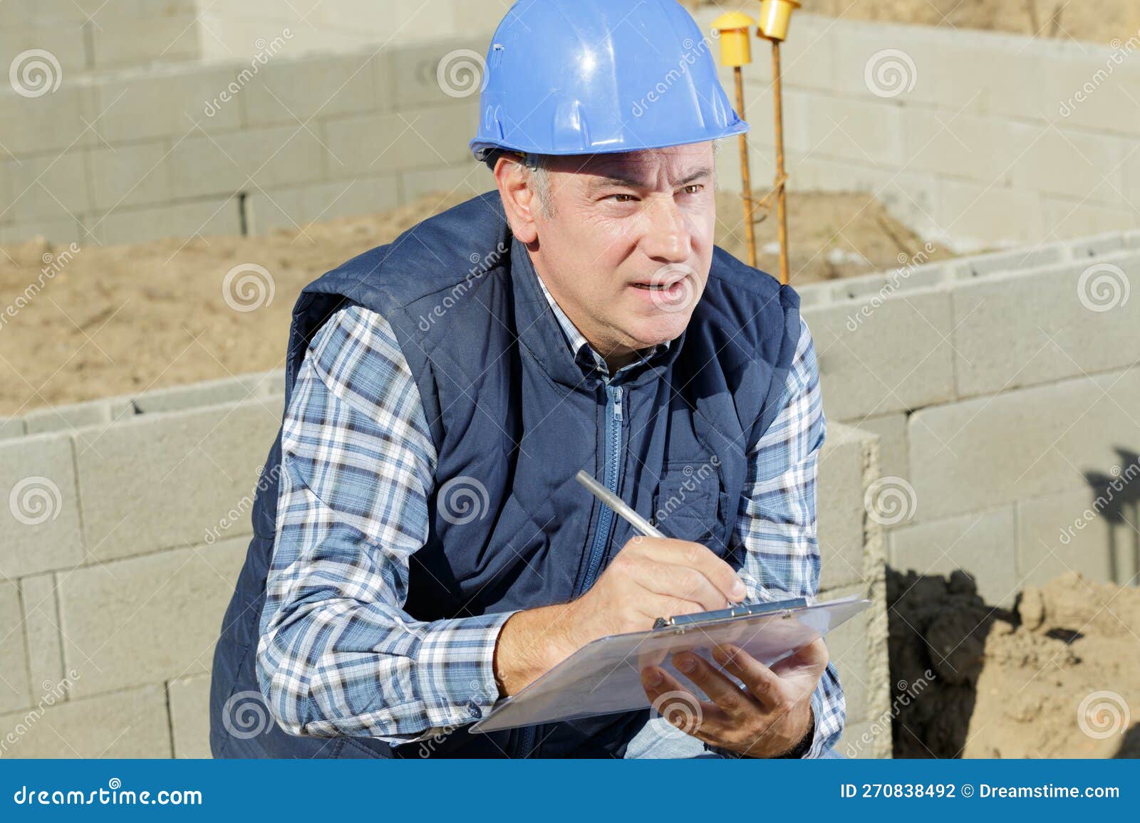 Industrial Engineer with Clipboard at Building Site Stock Photo - Image ...