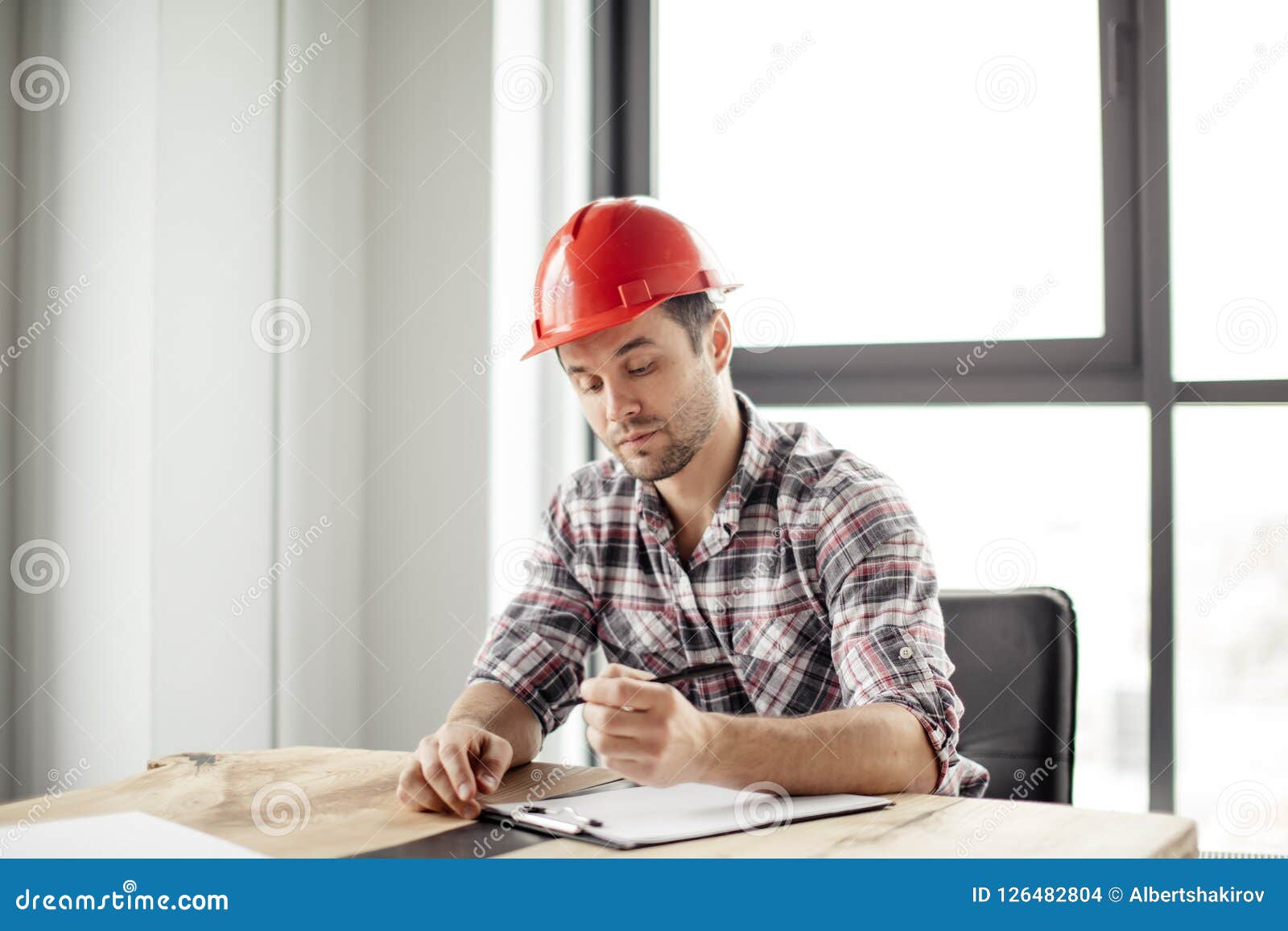 Industrial Engineer Writing Something on Notepad Stock Photo - Image of ...