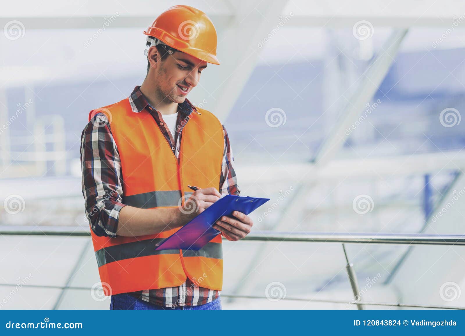 Industrial Engineer in Yellow Helmet Make Notes. Stock Photo - Image of ...