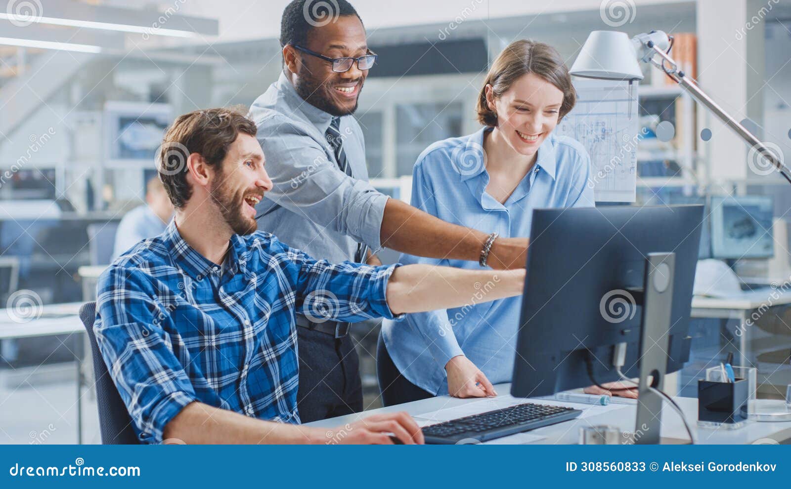 In the Industrial Engineering Facility: Male Engineer Working on ...