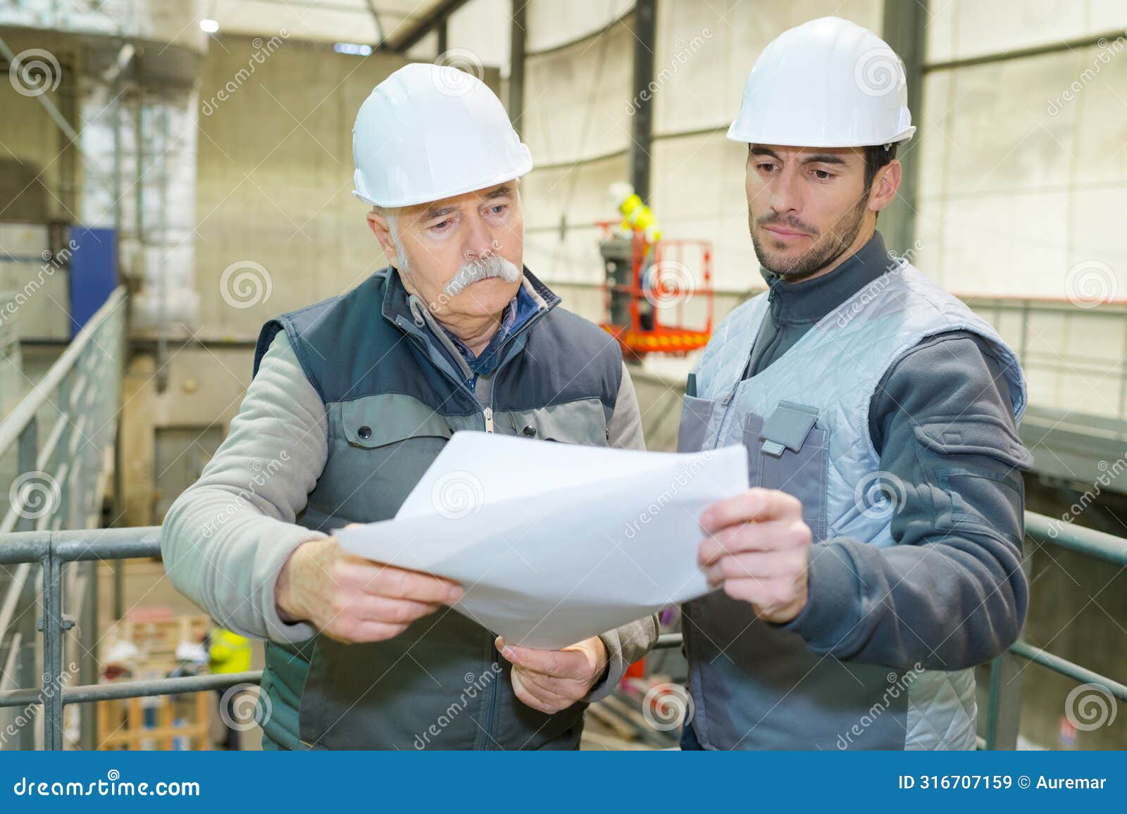 Industrial Engineers Looking at Blueprint Stock Image - Image of mature ...