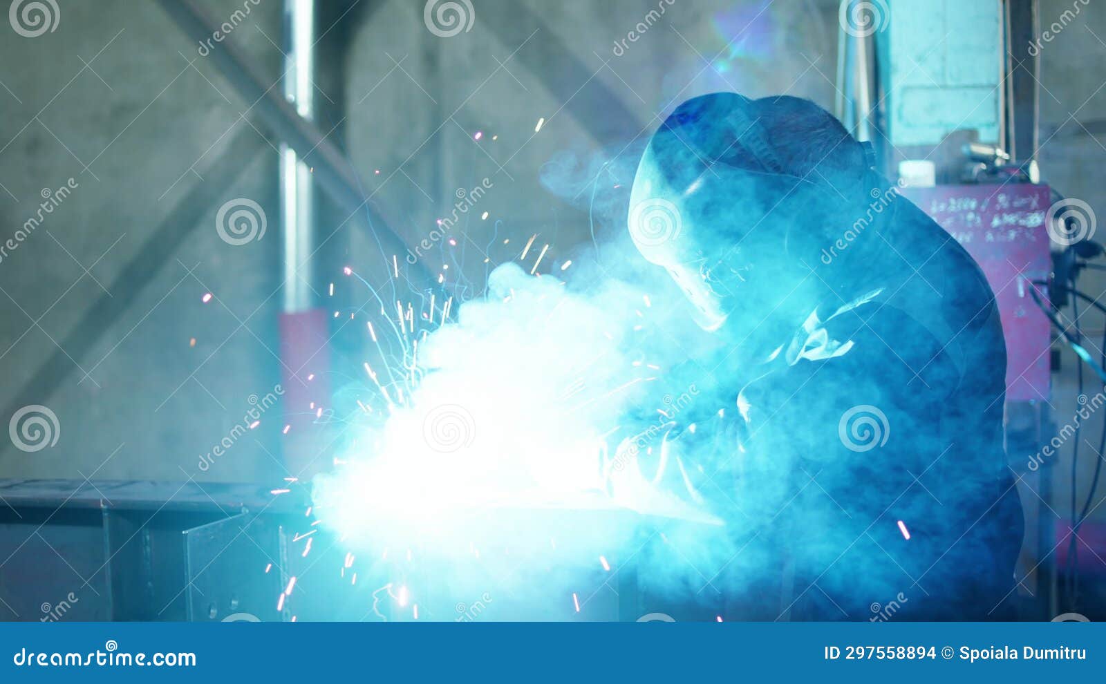In the Industrial Enterprise the Blacksmith Welder in Protective Mask ...