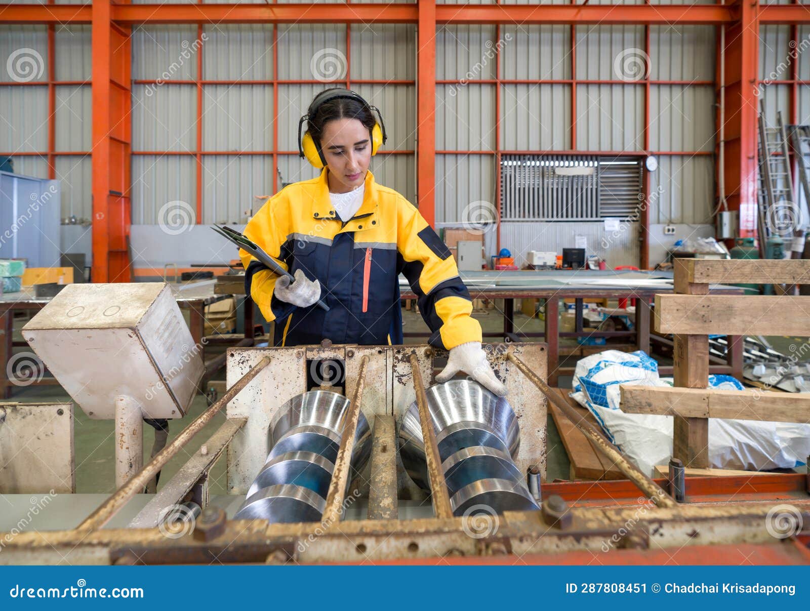 Industrial Environment with Focus on a Diligent Worker, Engrossed in ...