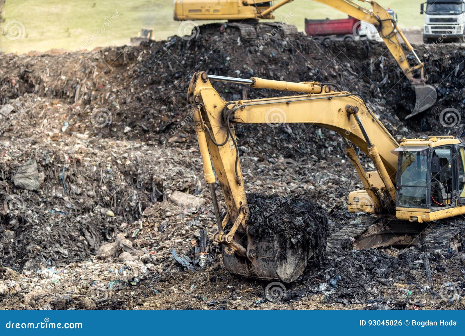 Industrial Excavator Digging into Trash at Urban Dumping Grounds Stock ...