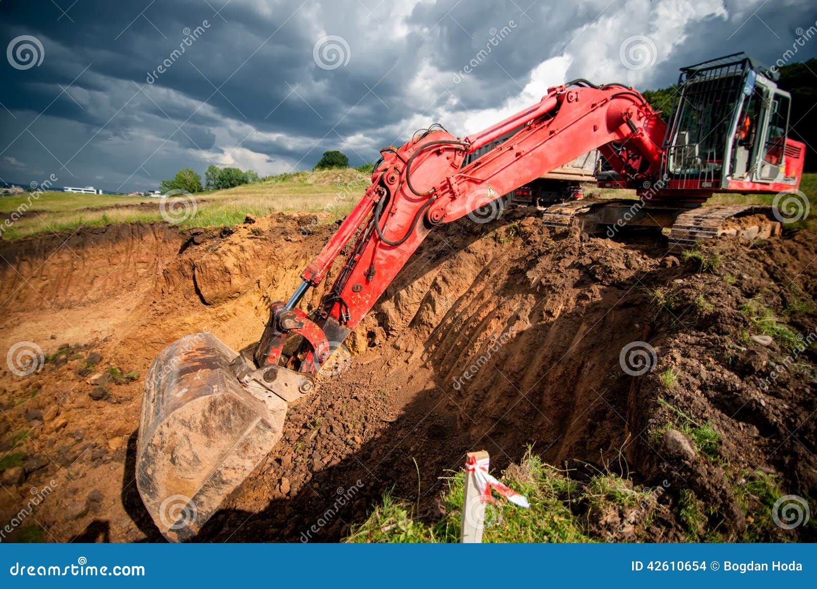 Excavator Is Loading Excavation To The Truck. Excavators Are Heavy ...
