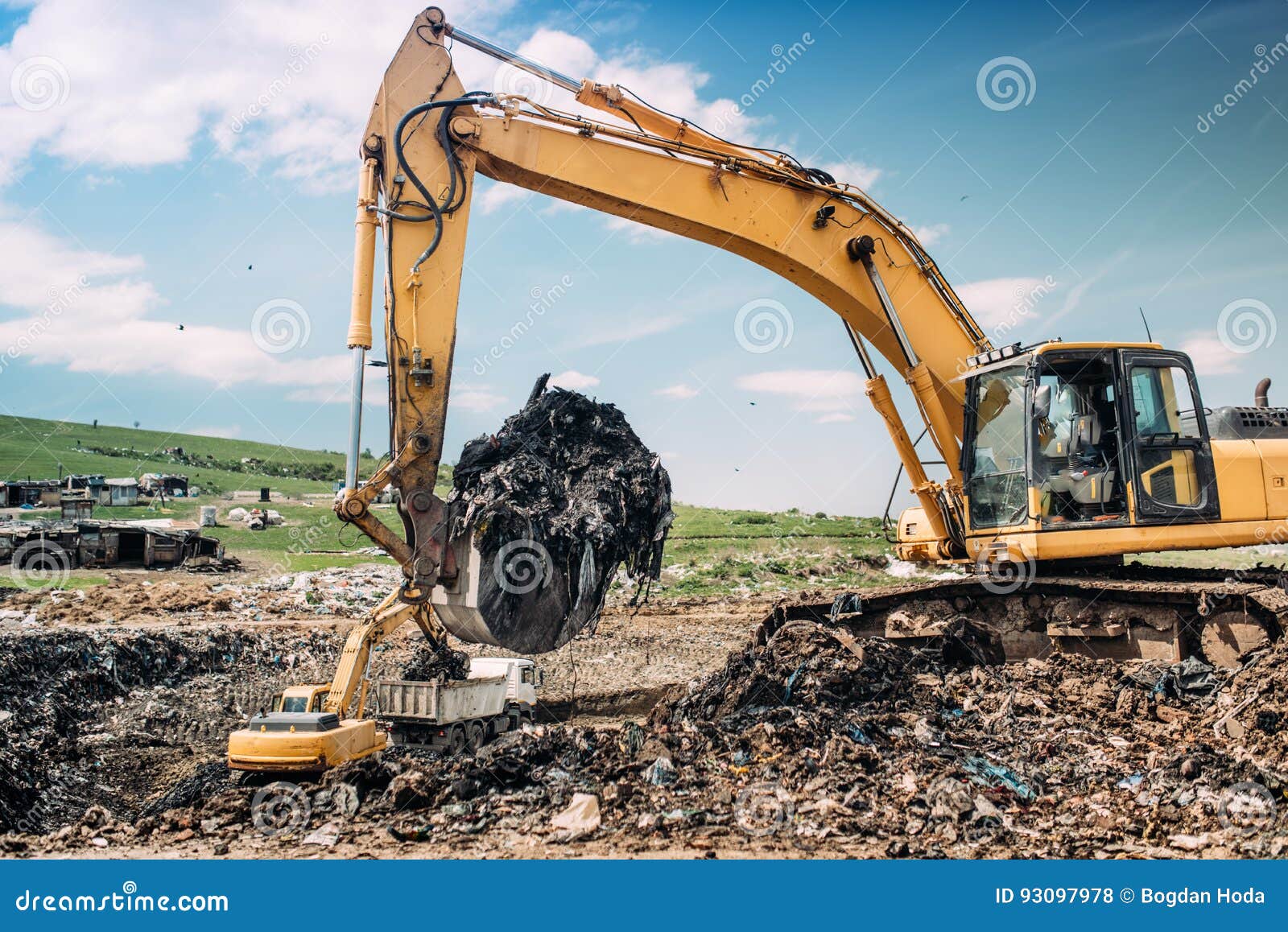 Industrial Excavators and Heavy Duty Machinery Working on Garbage Dump ...
