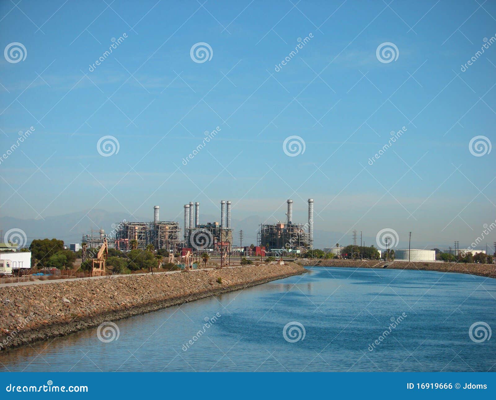 Industrial Factory Along River Stock Photo - Image of smokestacks ...