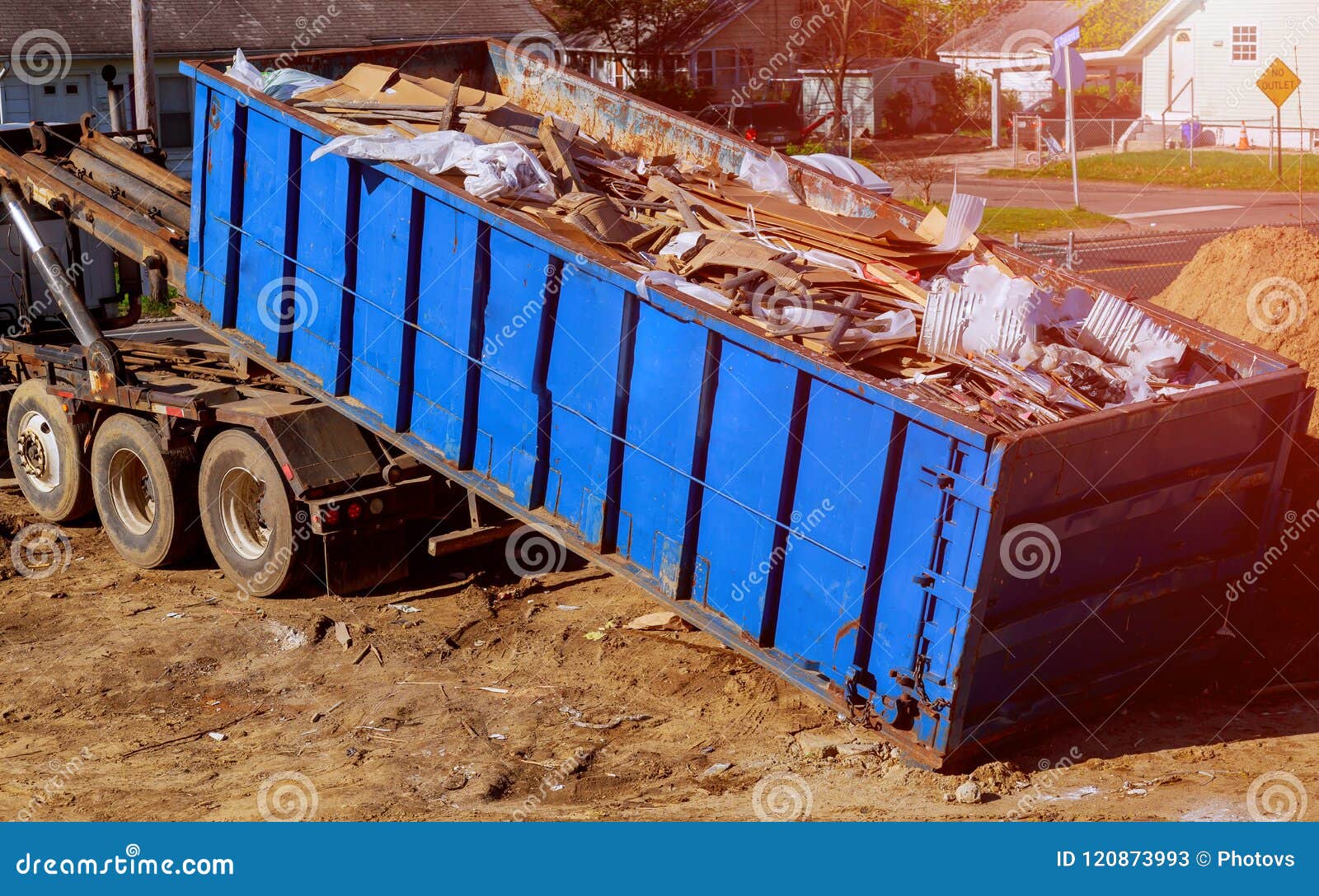 Blue Construction Debris Container Filled with Rock and Concrete Rubble ...