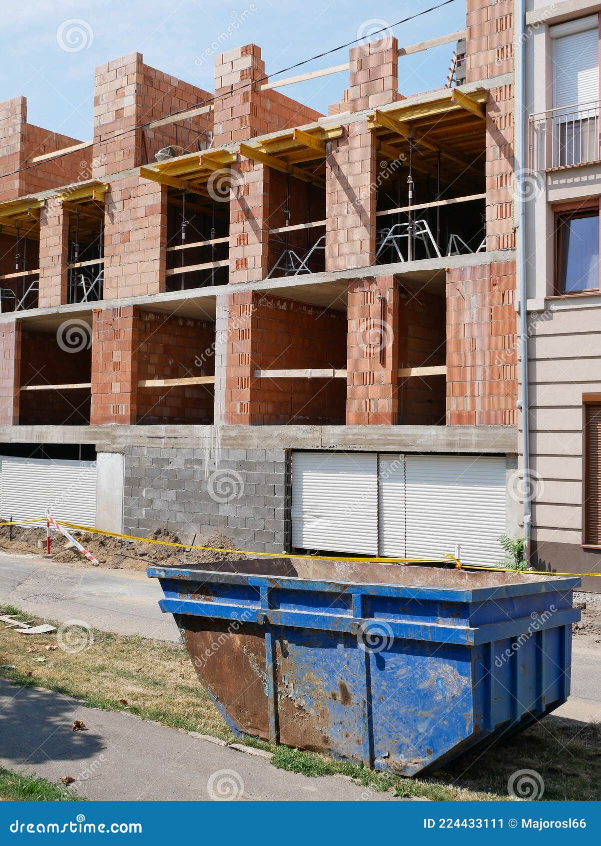 Industrial Garbage Can in Front of a Construction Site Stock Image ...