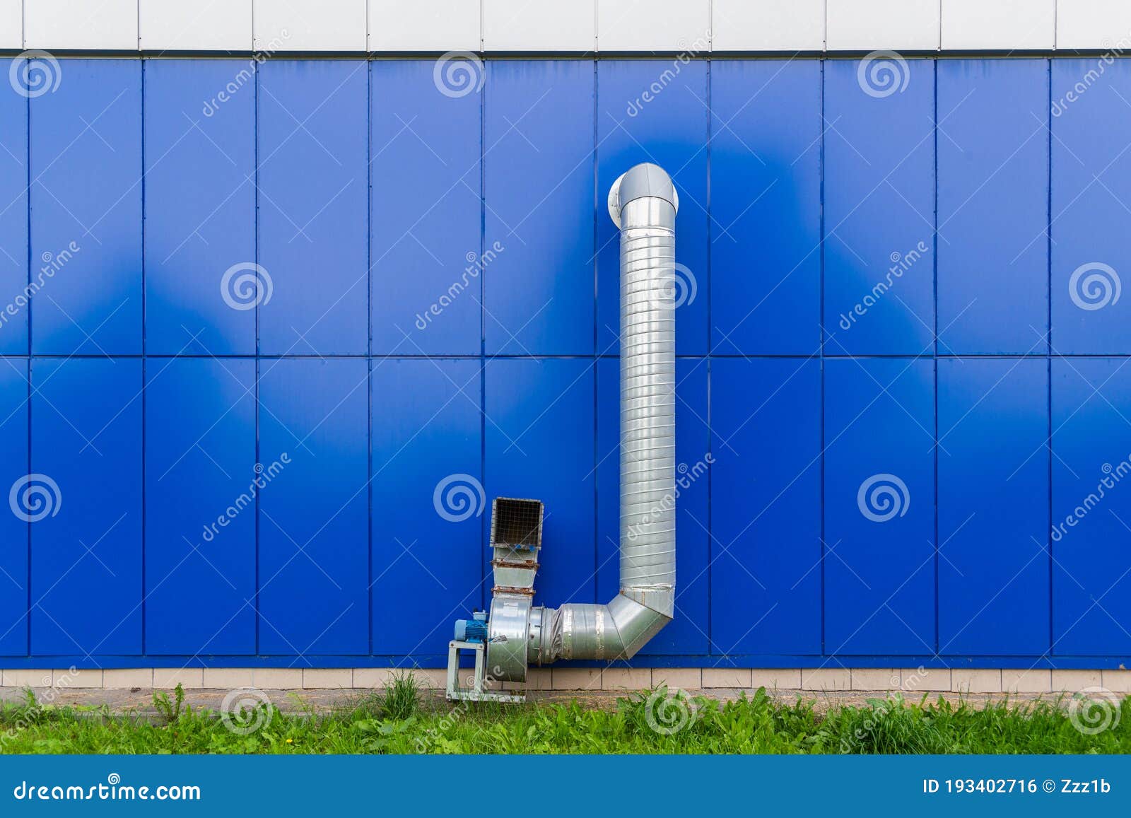 Industrial Grade Air Extraction Duct with Electrical Motor on Blue Wall ...
