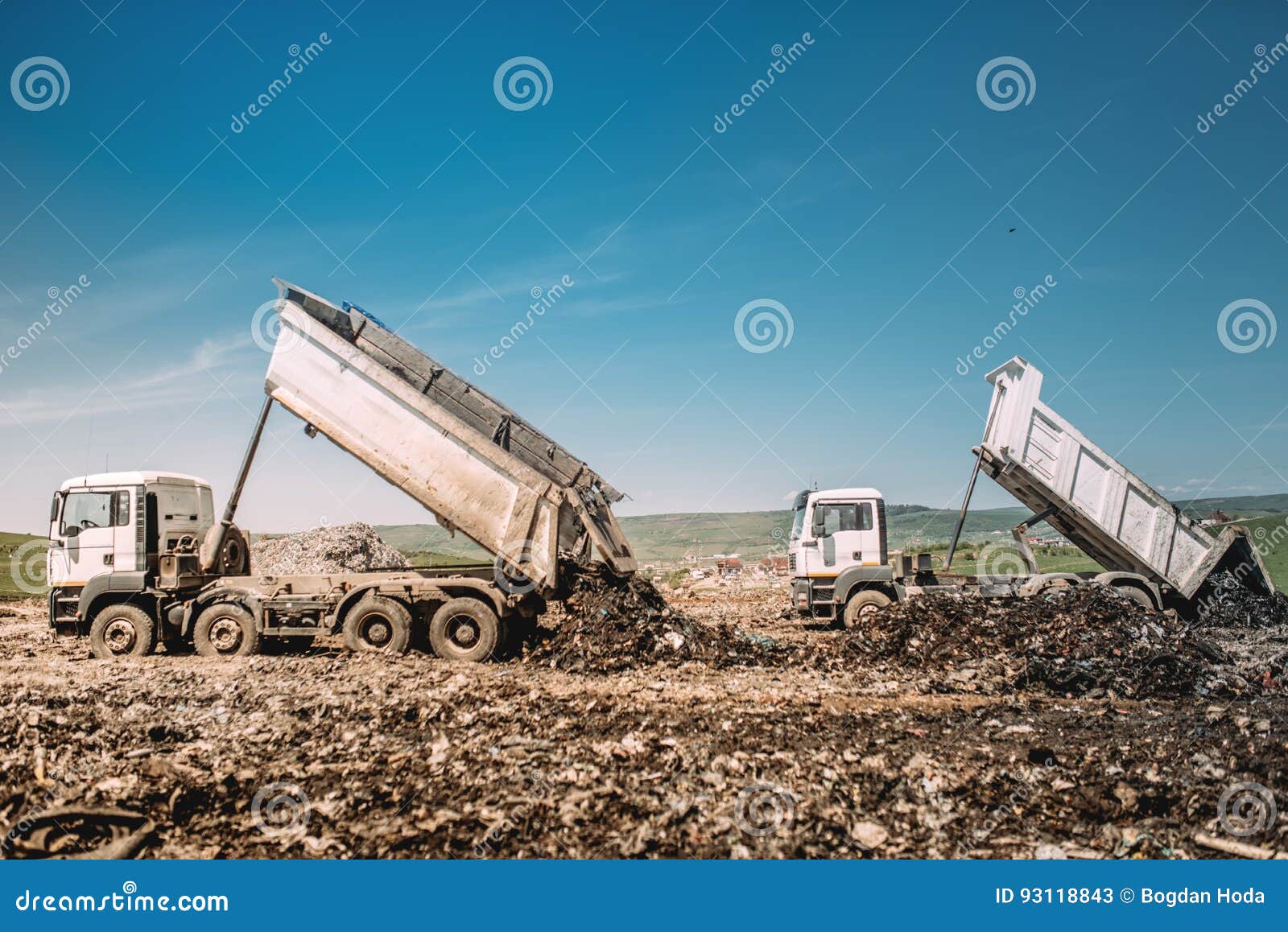 Industrial Heavy Duty Dumper Trucks Unloading at Construction Site ...