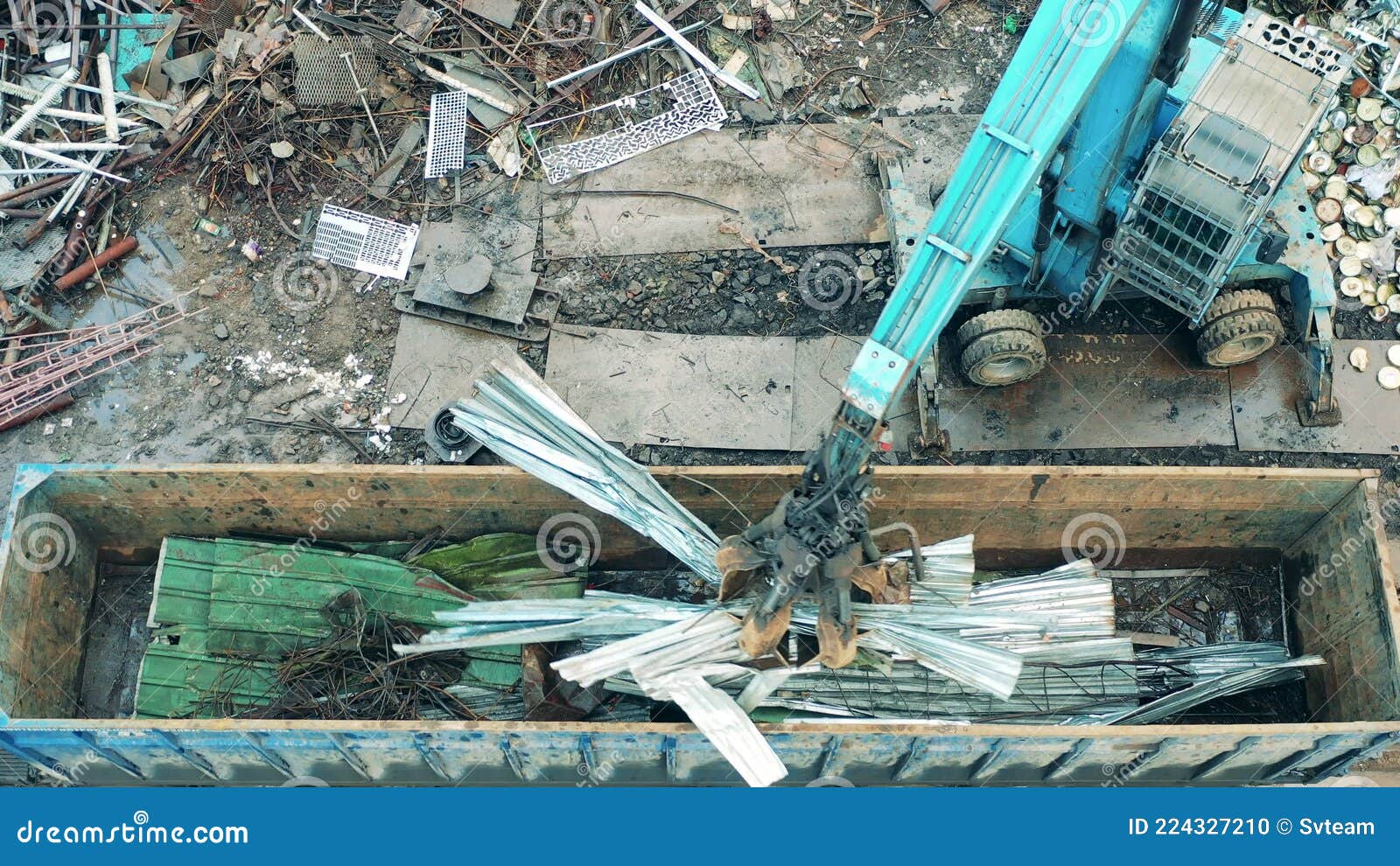 Industrial Machine is Loading Scrap Metal into a Container Stock ...
