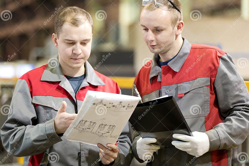 Industrial Manufacturing Workers Reading Engineering Drawing Stock ...