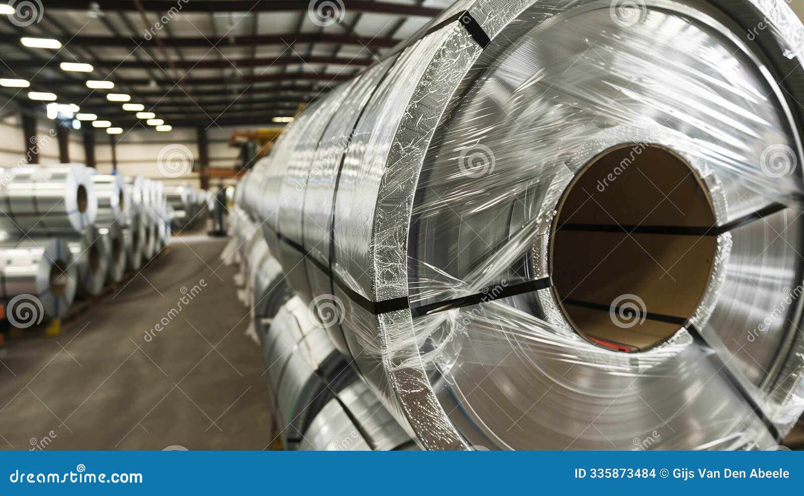 Industrial Metal Coils Wrapped in Plastic Packaging in Warehouse Stock ...