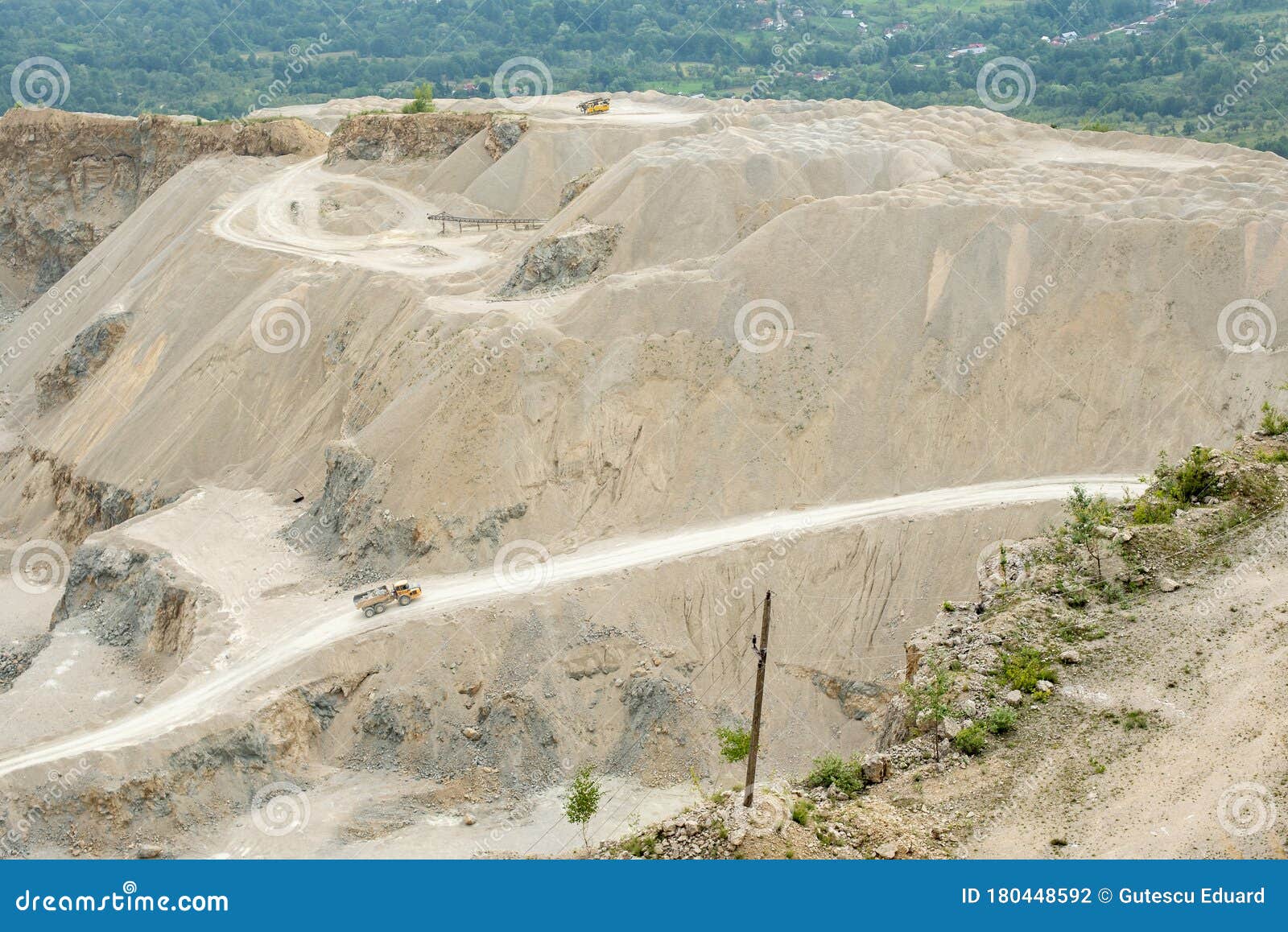 Industrial Mining Extraction Site with Big Tracks on Huge Quarry. Stock ...