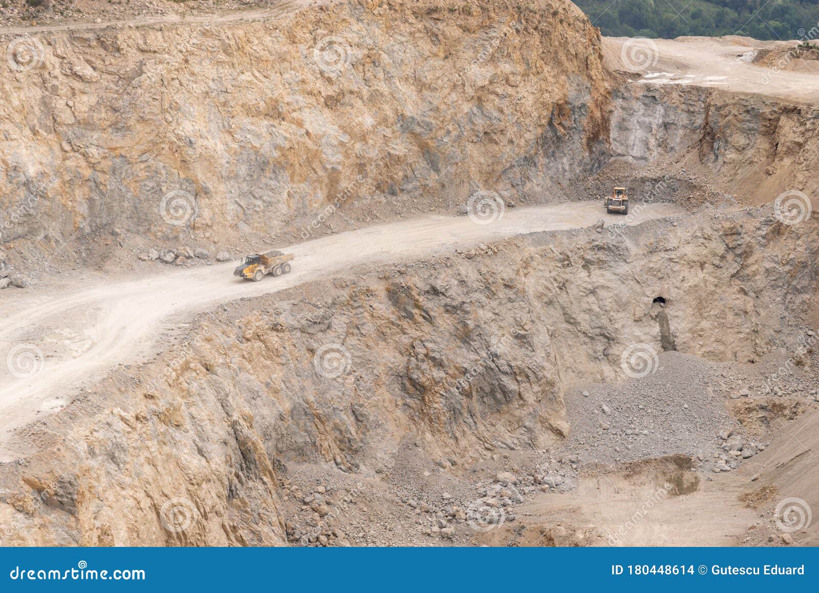 Industrial Mining Extraction Site with Big Tracks on Huge Quarry. Stock ...