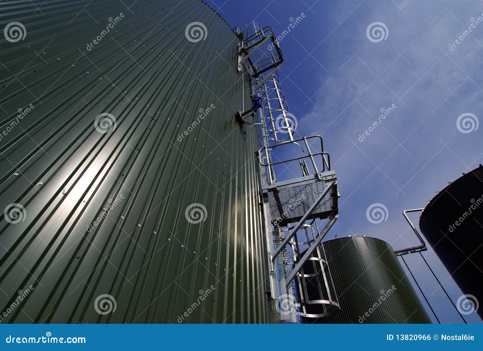 Industrial Pipelines and Tanks Against Blue Sky Stock Photo - Image of ...