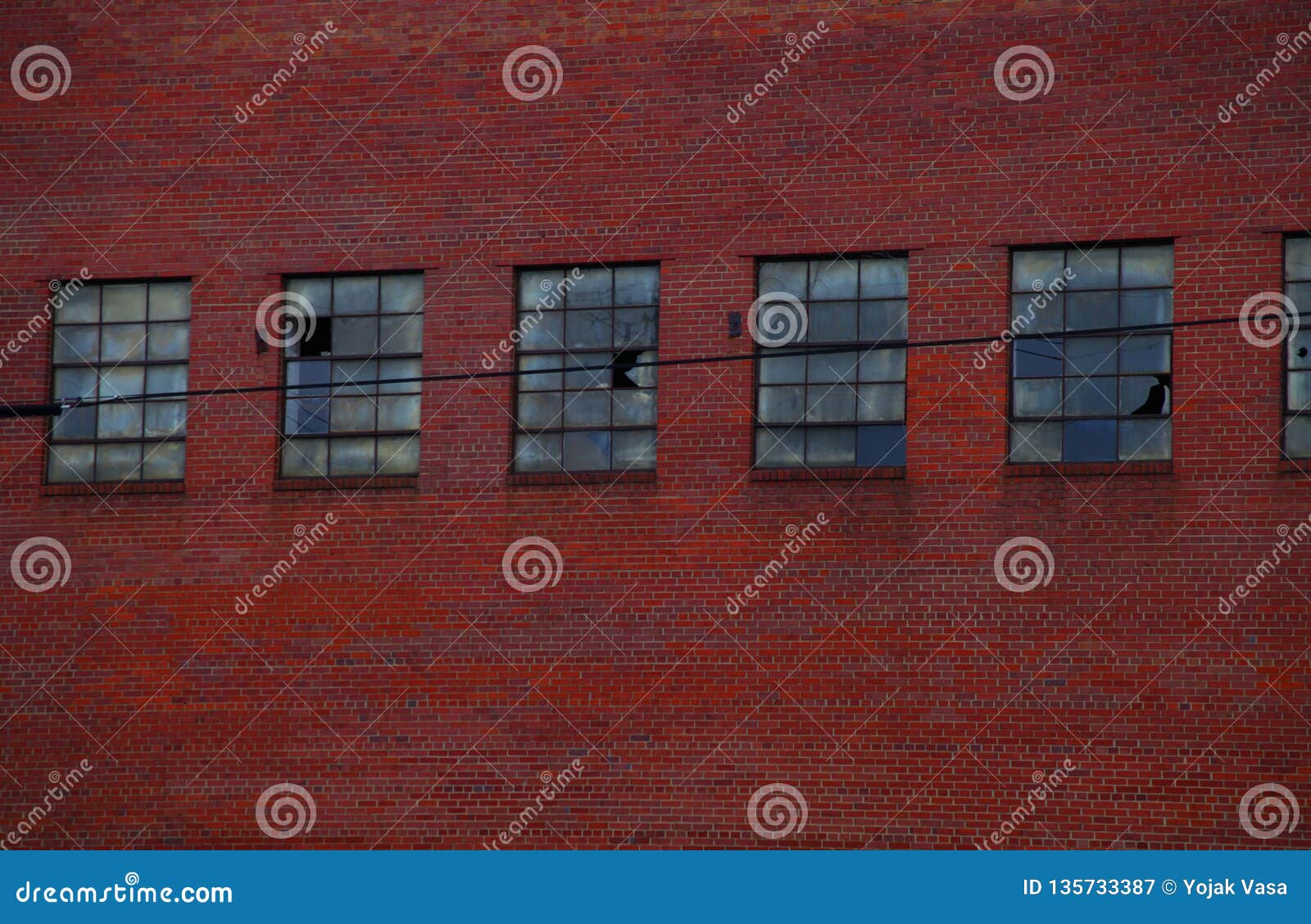 Industrial Red Brick Facade with Broken Windows Stock Image - Image of ...