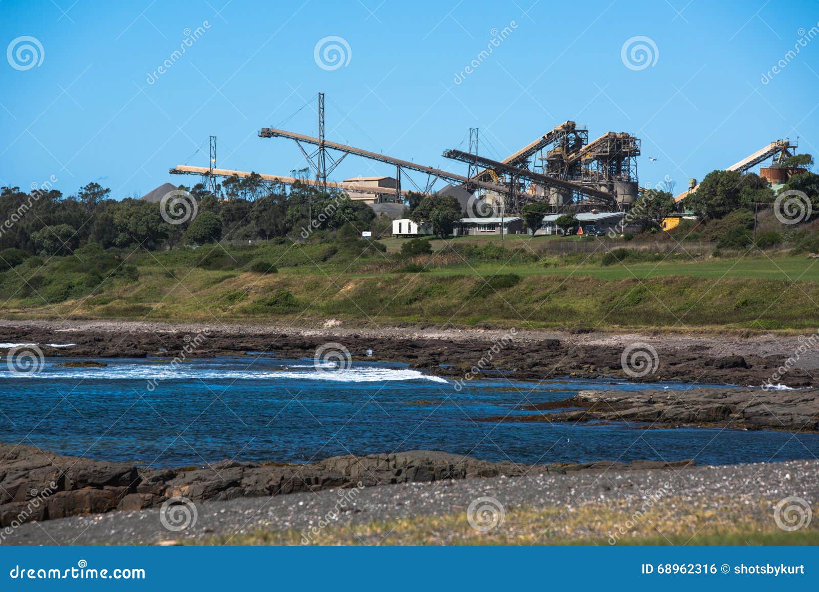 Industrial Refinery or Construction Material Yard by the Ocean Stock ...