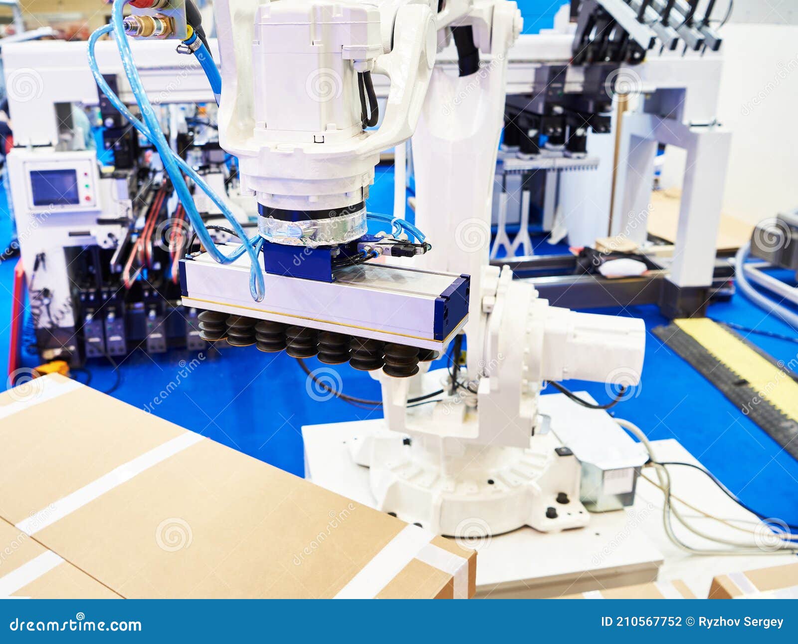 Industrial Robot Manipulator for Moving Boxes and Goods Stock Photo ...