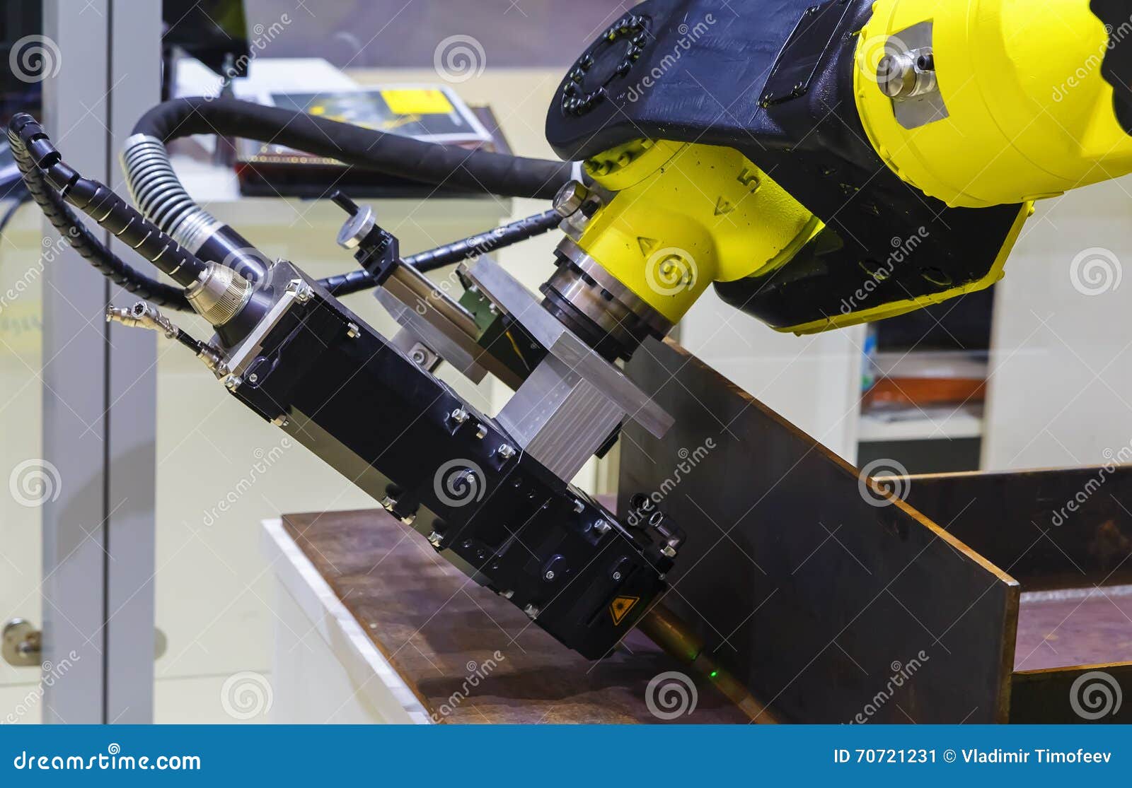 Industrial Robot Performs an Operation of Cutting Metal Stock Image ...
