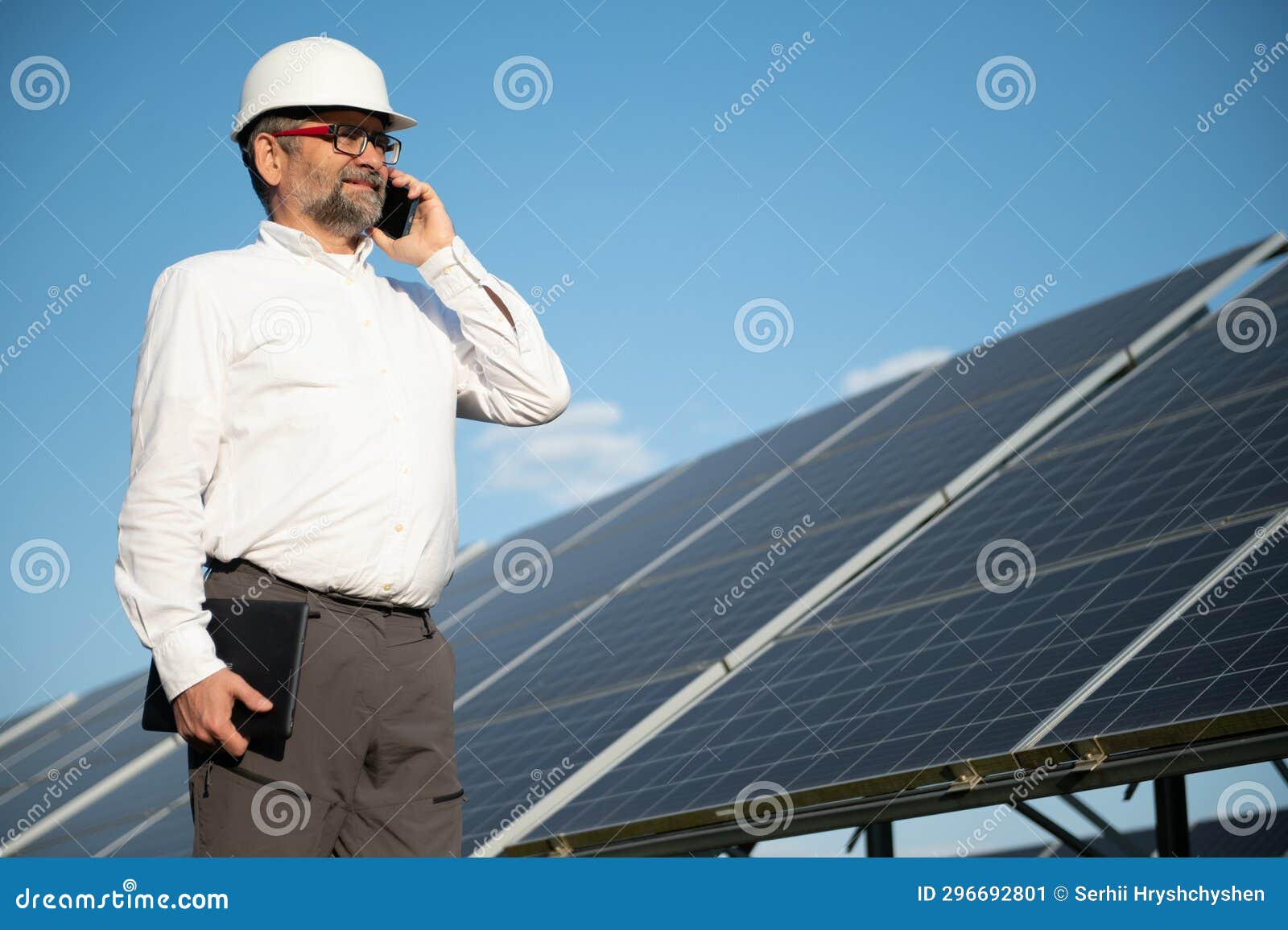 Industrial Senior Man Engineer Walking through Solar Panel Field for ...
