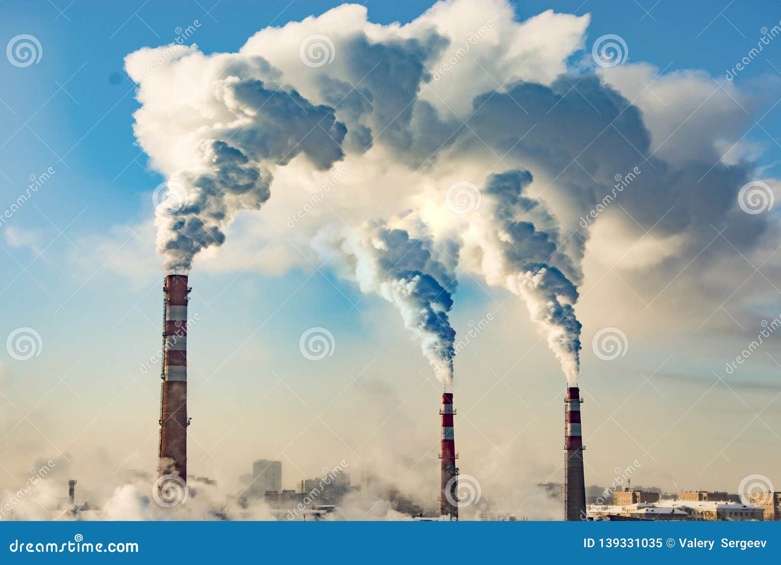 Industrial Smokestacks Against the Blue Sky . Stock Image - Image of ...