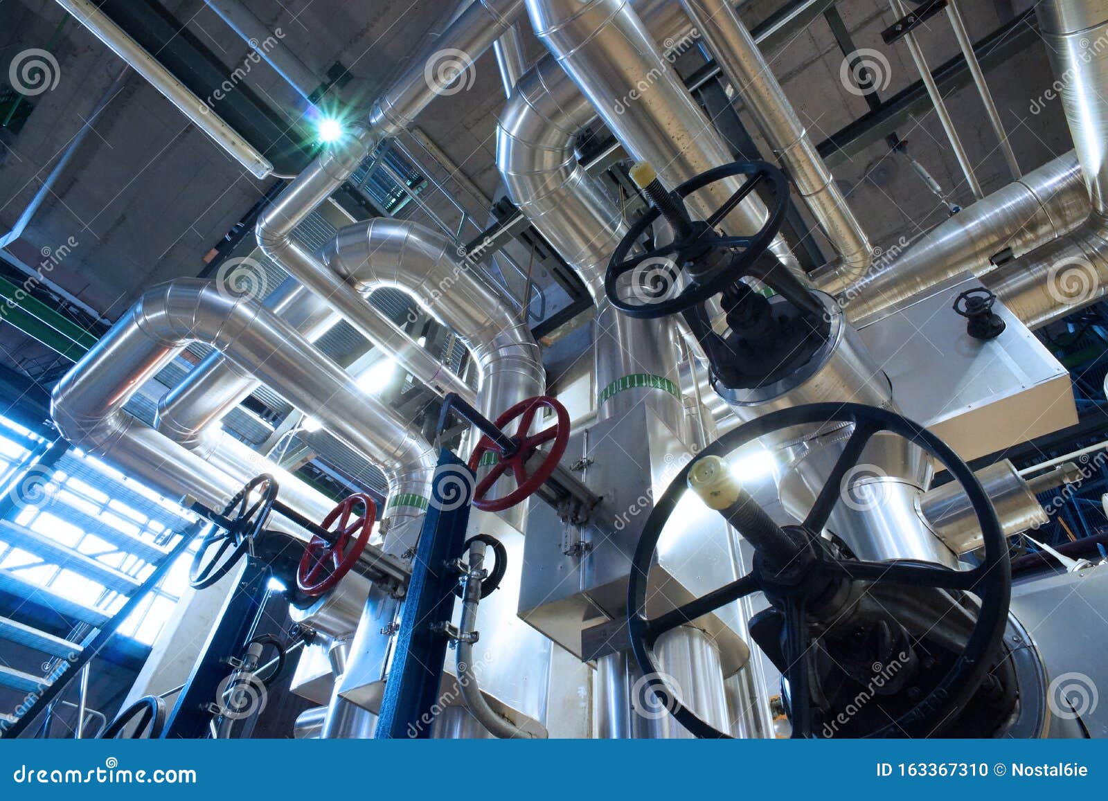 Industrial Steel Pipelines, Valves, Cables and Walkways Stock Photo ...