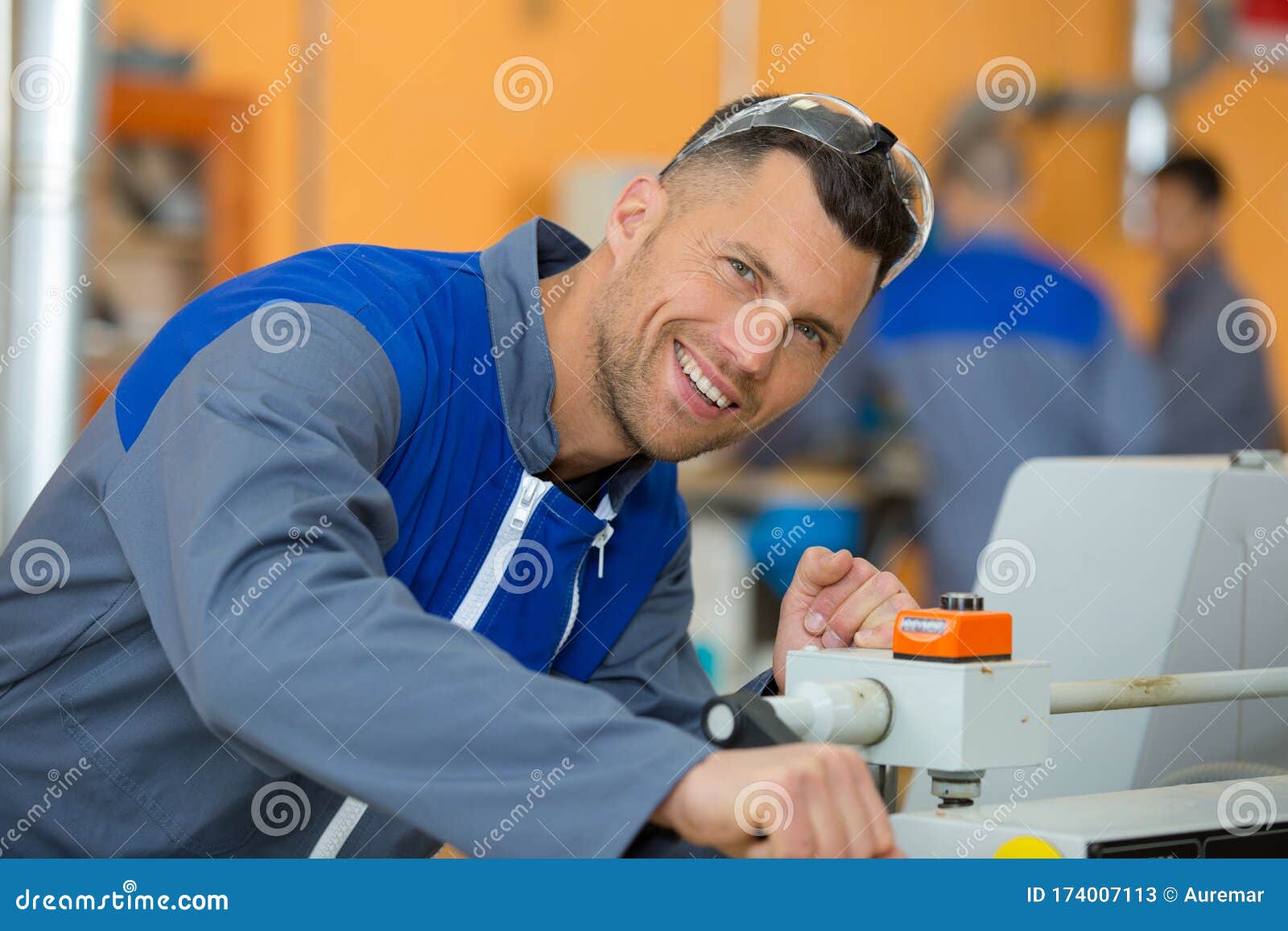Industrial Technician Repairing Modern Computerized Machine in Factory ...