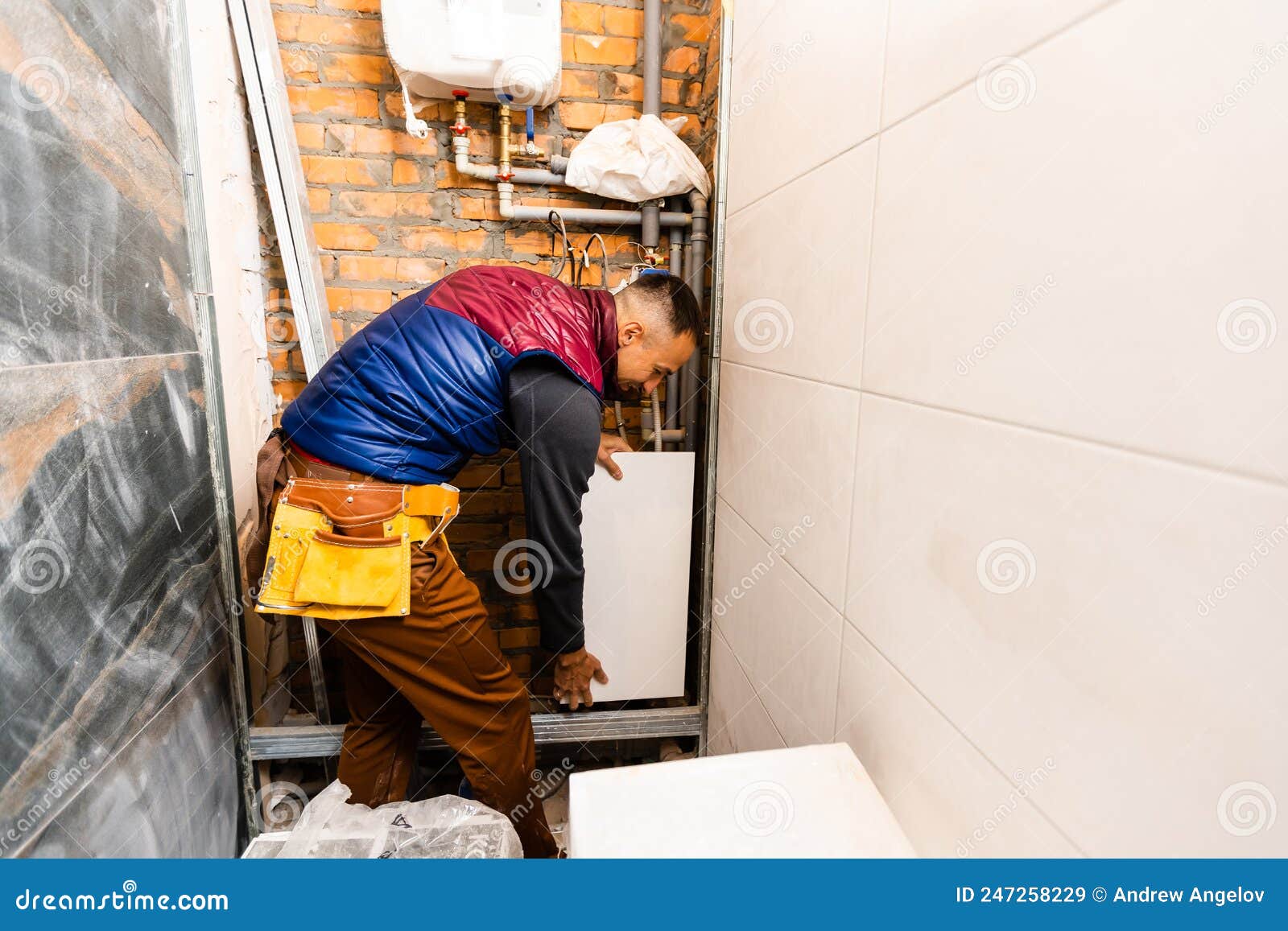 Industrial Tiler Builder Worker Installing Floor Tile at Repair ...