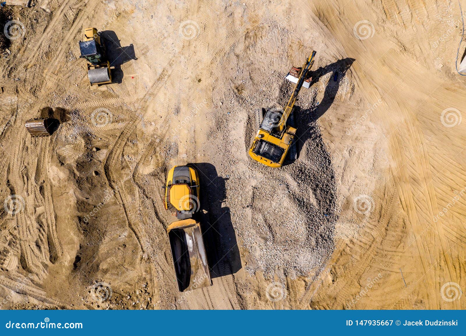 Excavator Moving Earth And Unloading Into A Dumper Truck Editorial ...