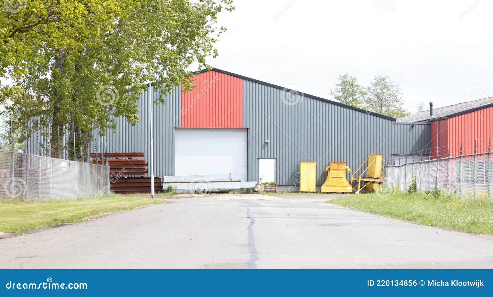 Industrial Warehouse with Roller Doors Stock Photo - Image of ...