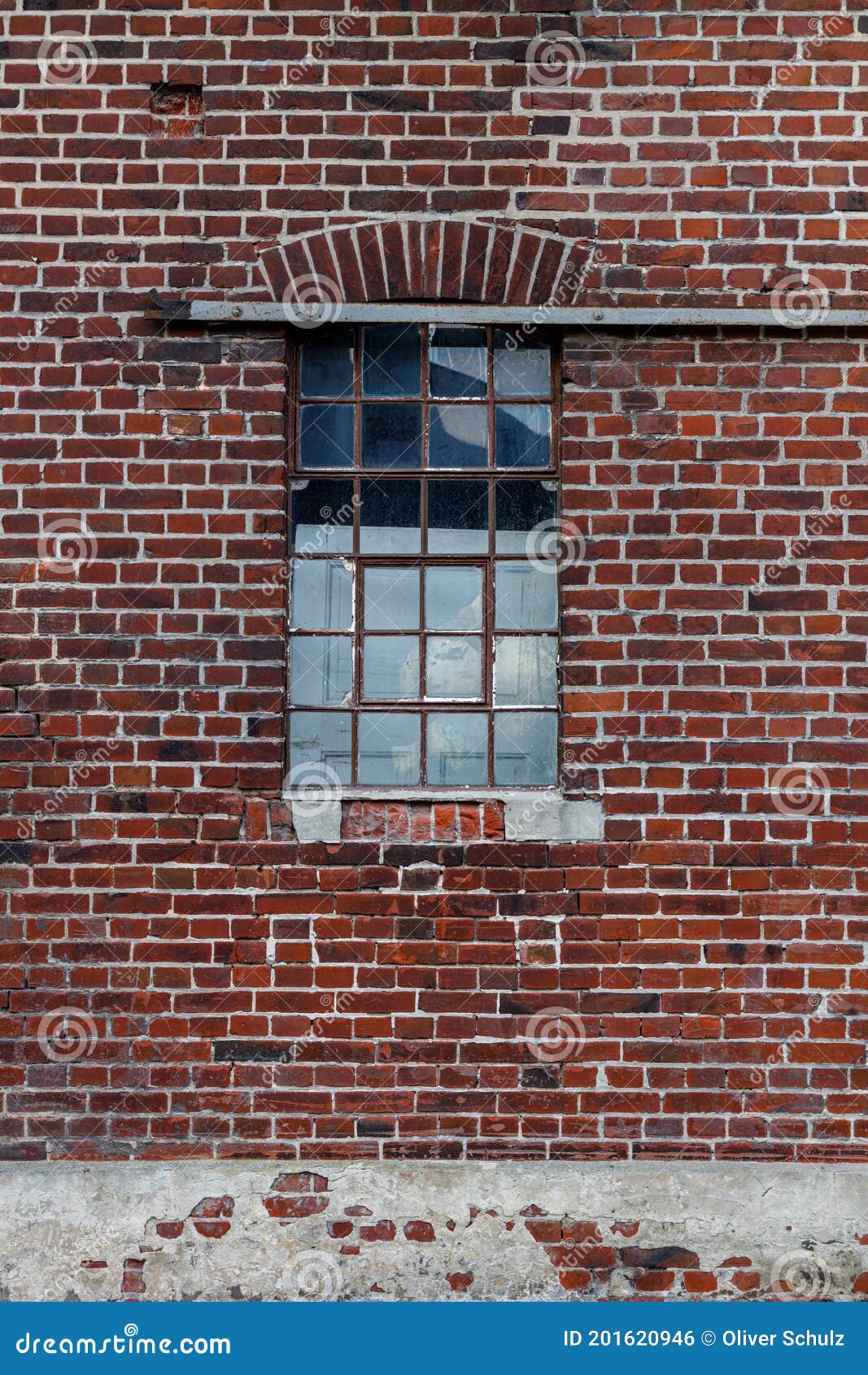 Industrial Window with a Metal Rusted Frame on a Red Damaged Brick Wall ...