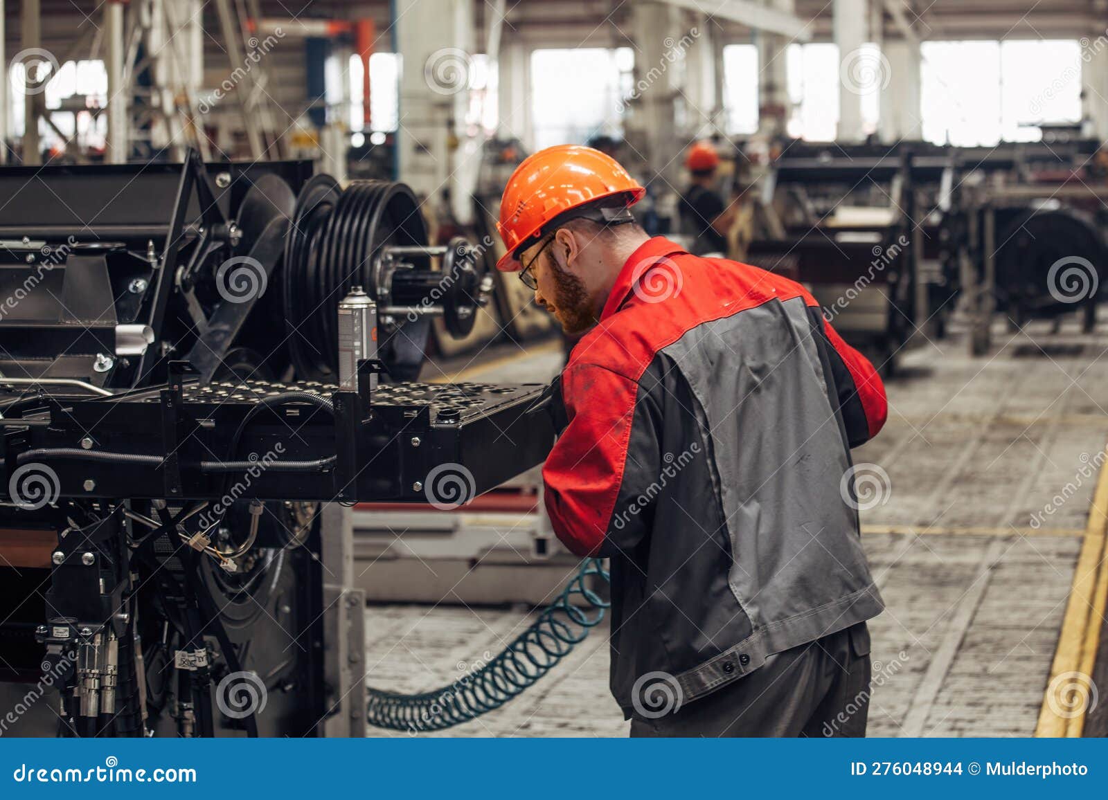 Industrial Worker Assembles Agricultural Machine in Workshop Stock ...