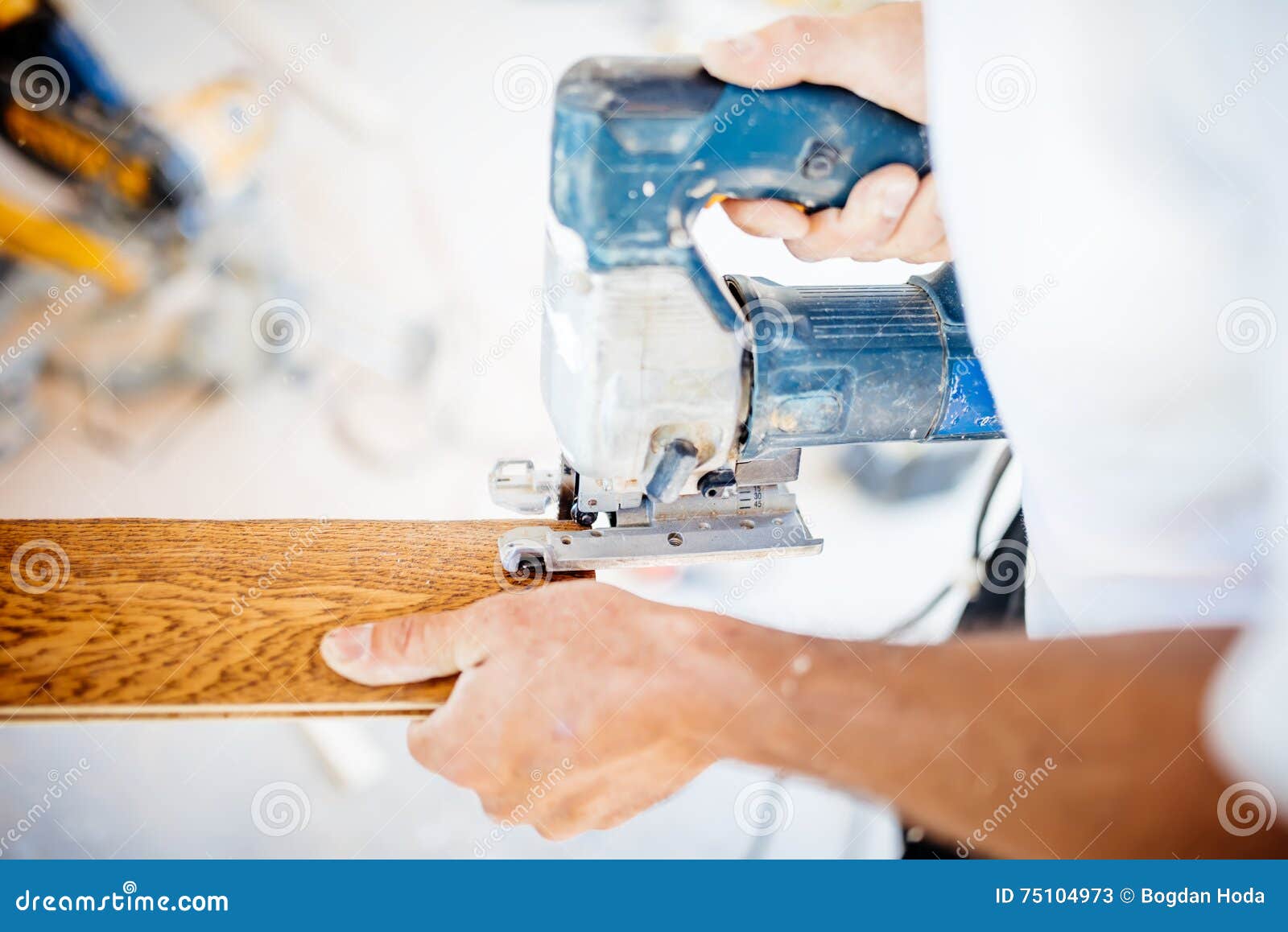 Industrial Worker Builder Working with Electric Jigsaw and Wood Stock ...