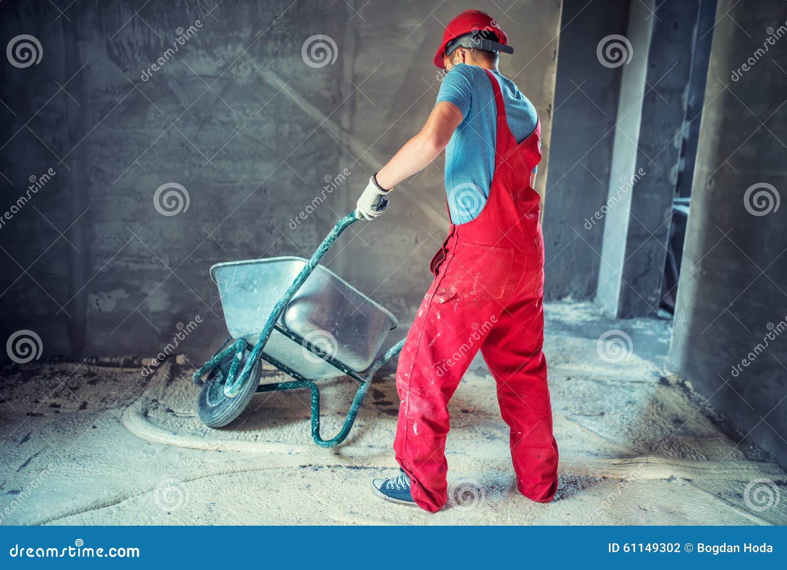 Industrial Worker, Engineer on Construction Site, Pushing a Wheelbarrow ...