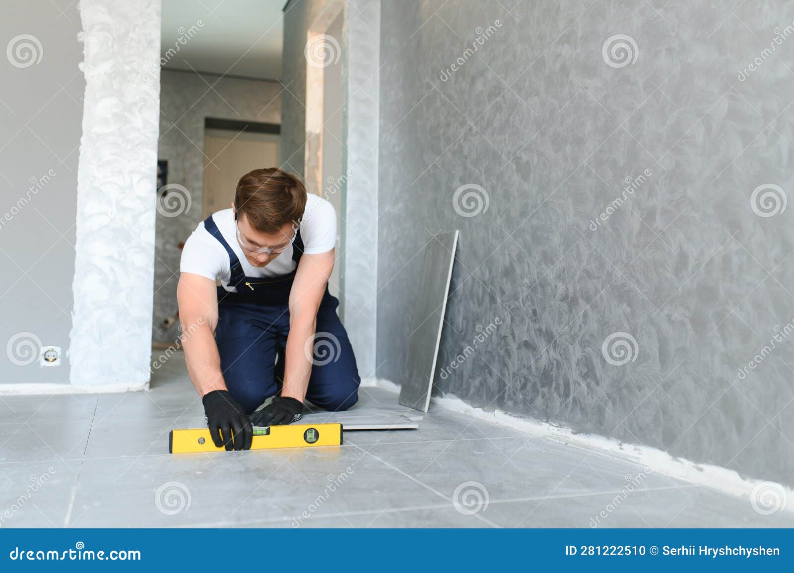 Industrial Worker, Handyman Installing Big Ceramic Tiles Stock Photo ...