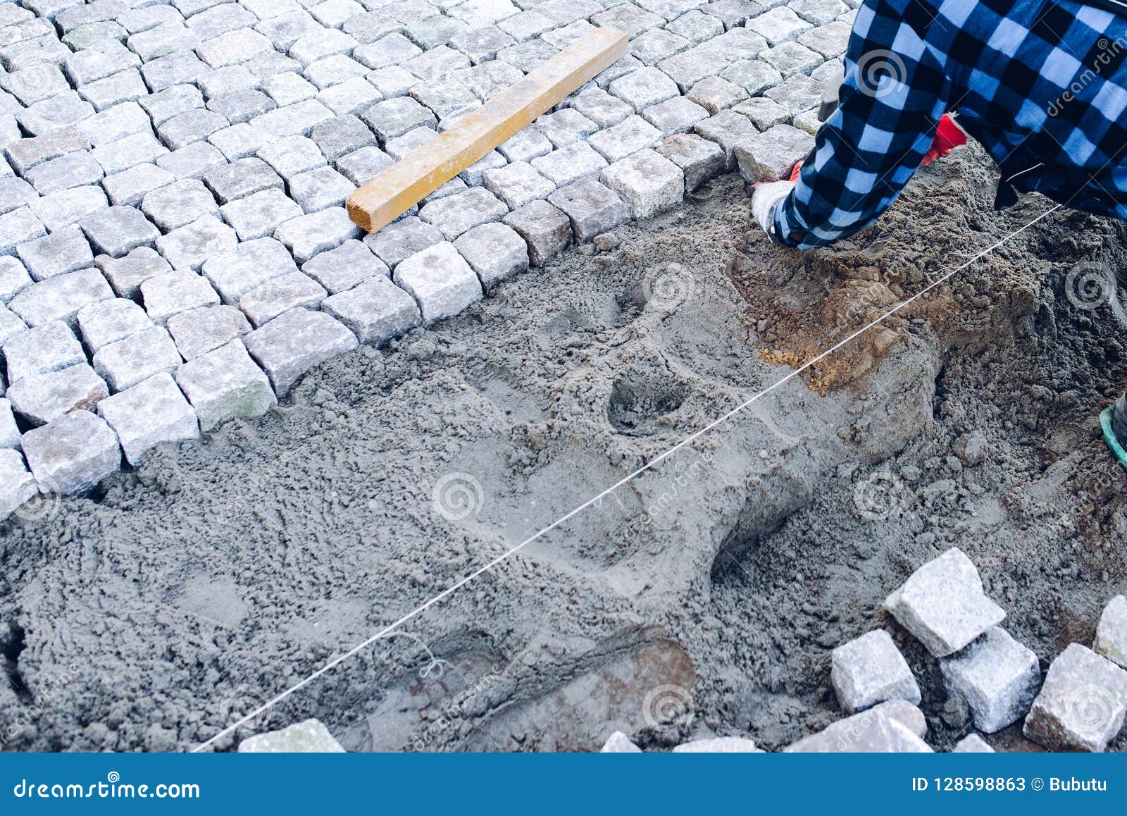 Industrial Worker Installing Pavement Rocks, Cobblestone Blocks Stock ...