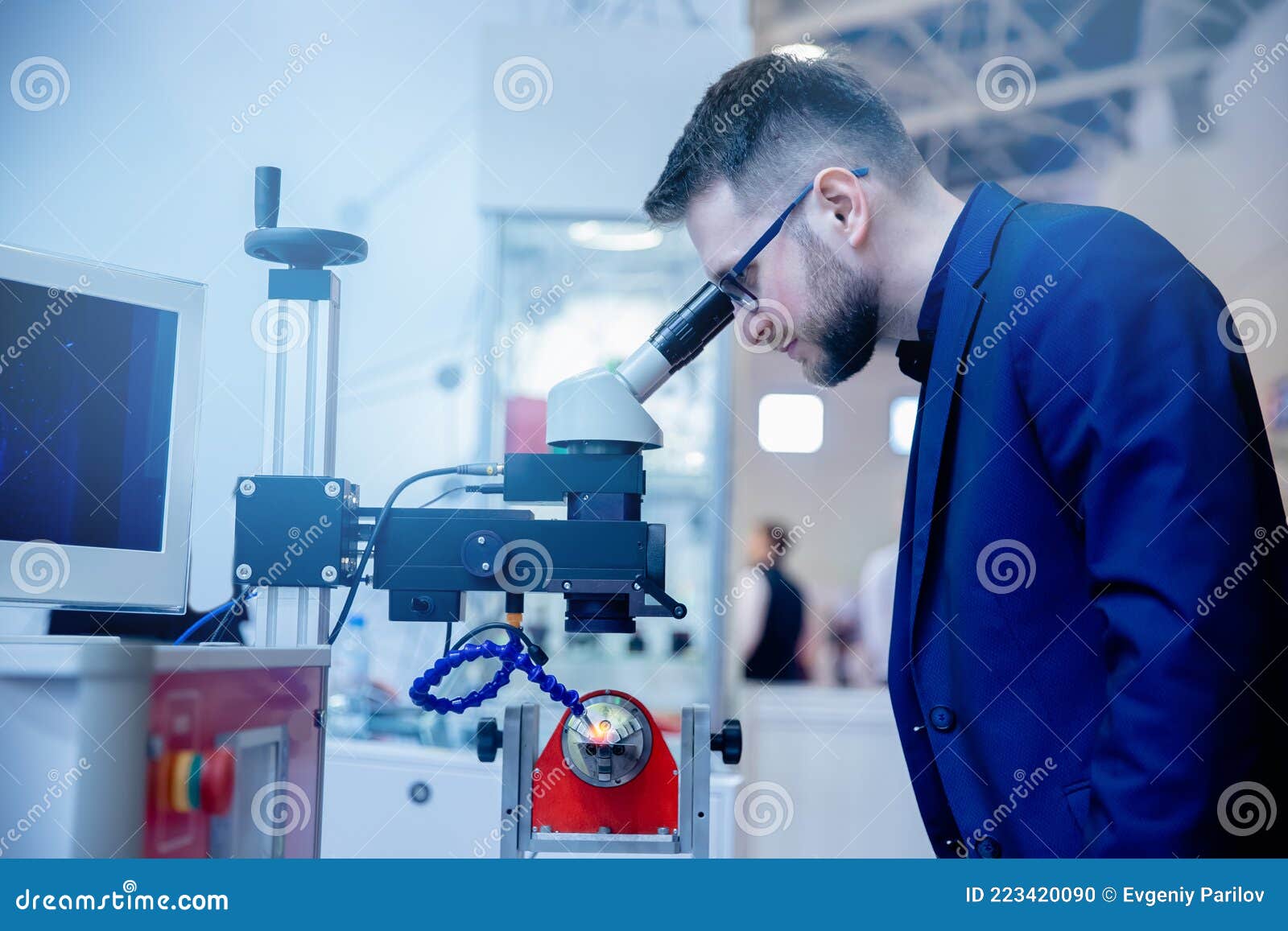 Industrial Worker Use Microscope for Precision Plasma Welding at Modern ...