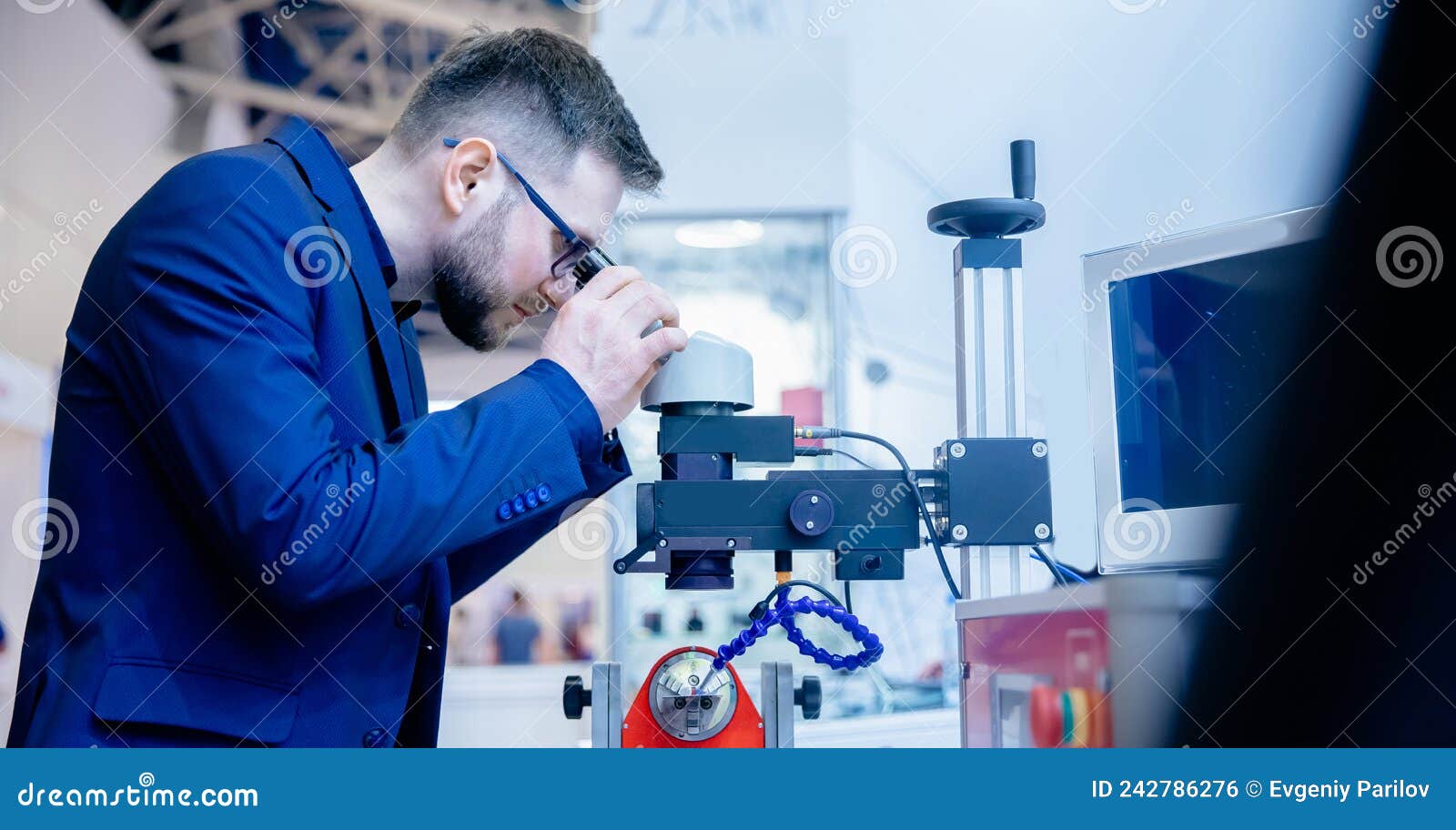 Industrial Worker Use Microscope for Precision Plasma Welding at Modern ...